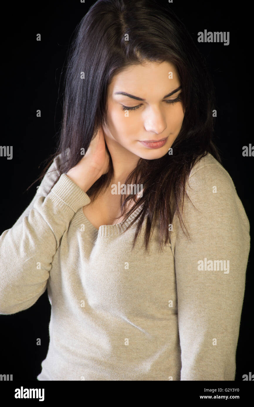 Beautiful young woman hand touching neck Stock Photo - Alamy