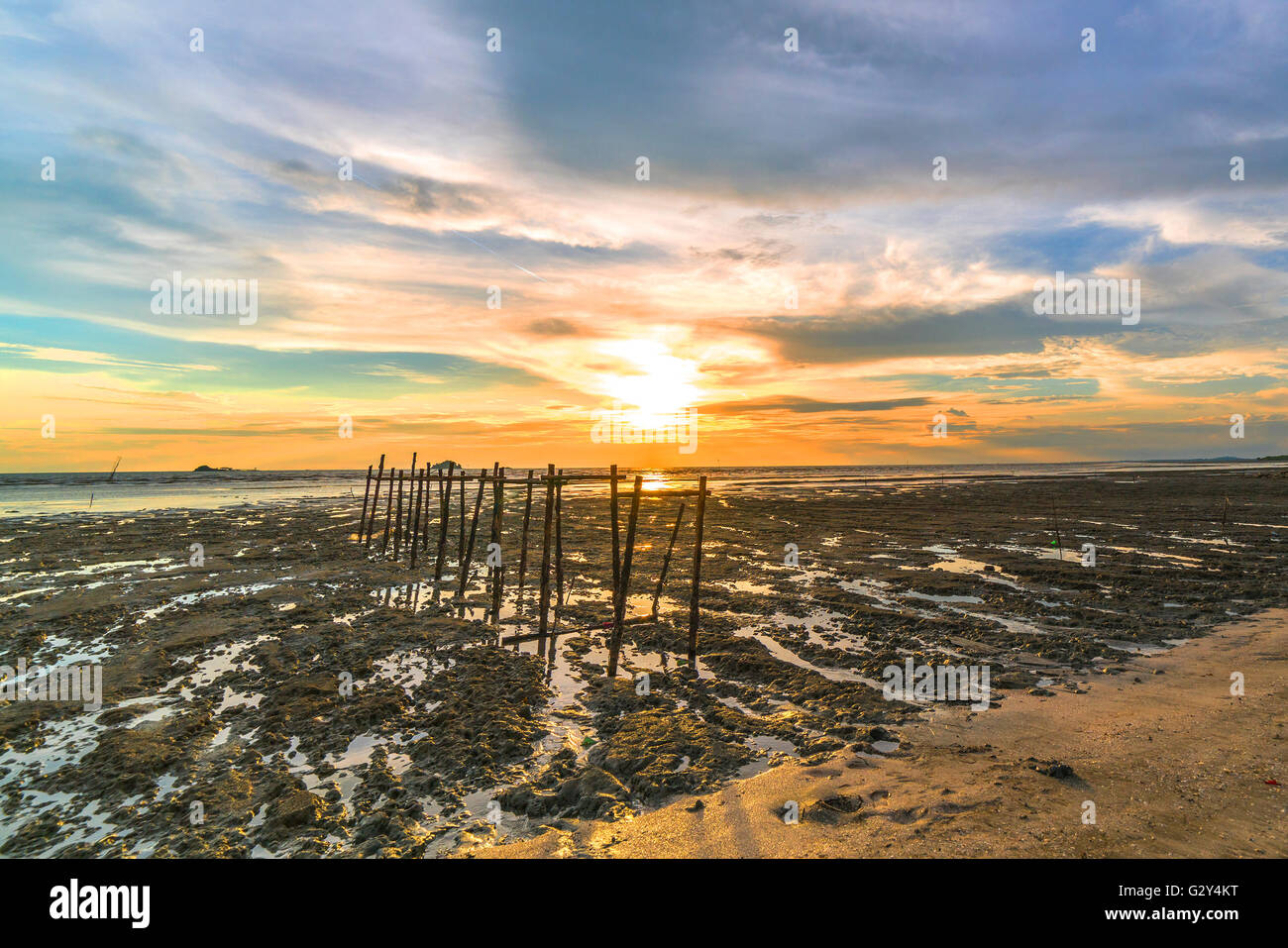 Wooden jetty with sunset background Stock Photo - Alamy
