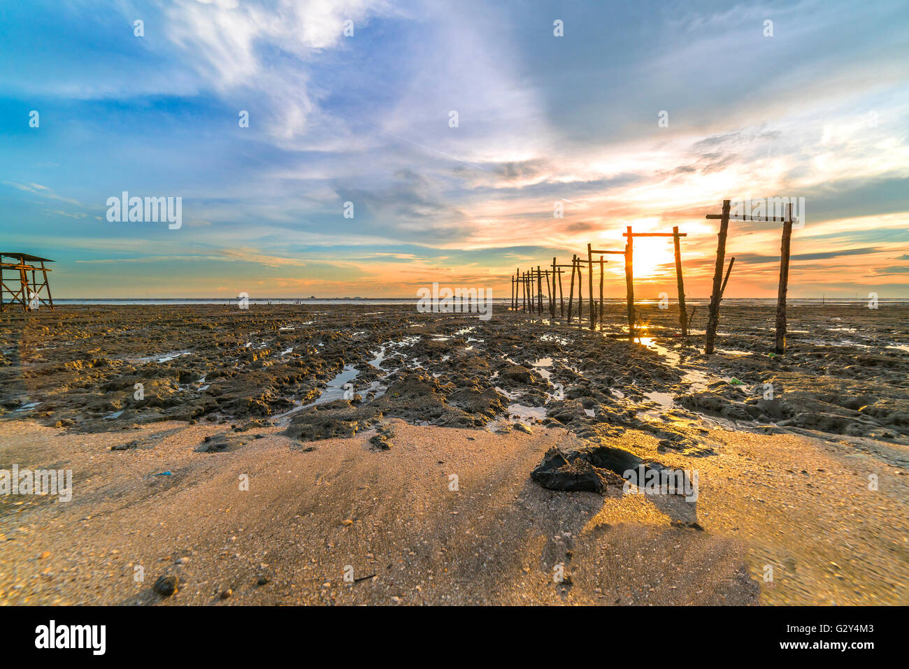 Wooden jetty with sunset background Stock Photo - Alamy