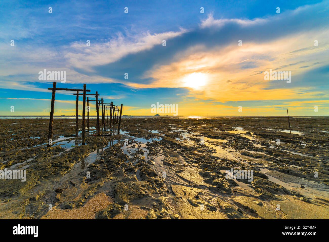 Wooden jetty with sunset background Stock Photo - Alamy