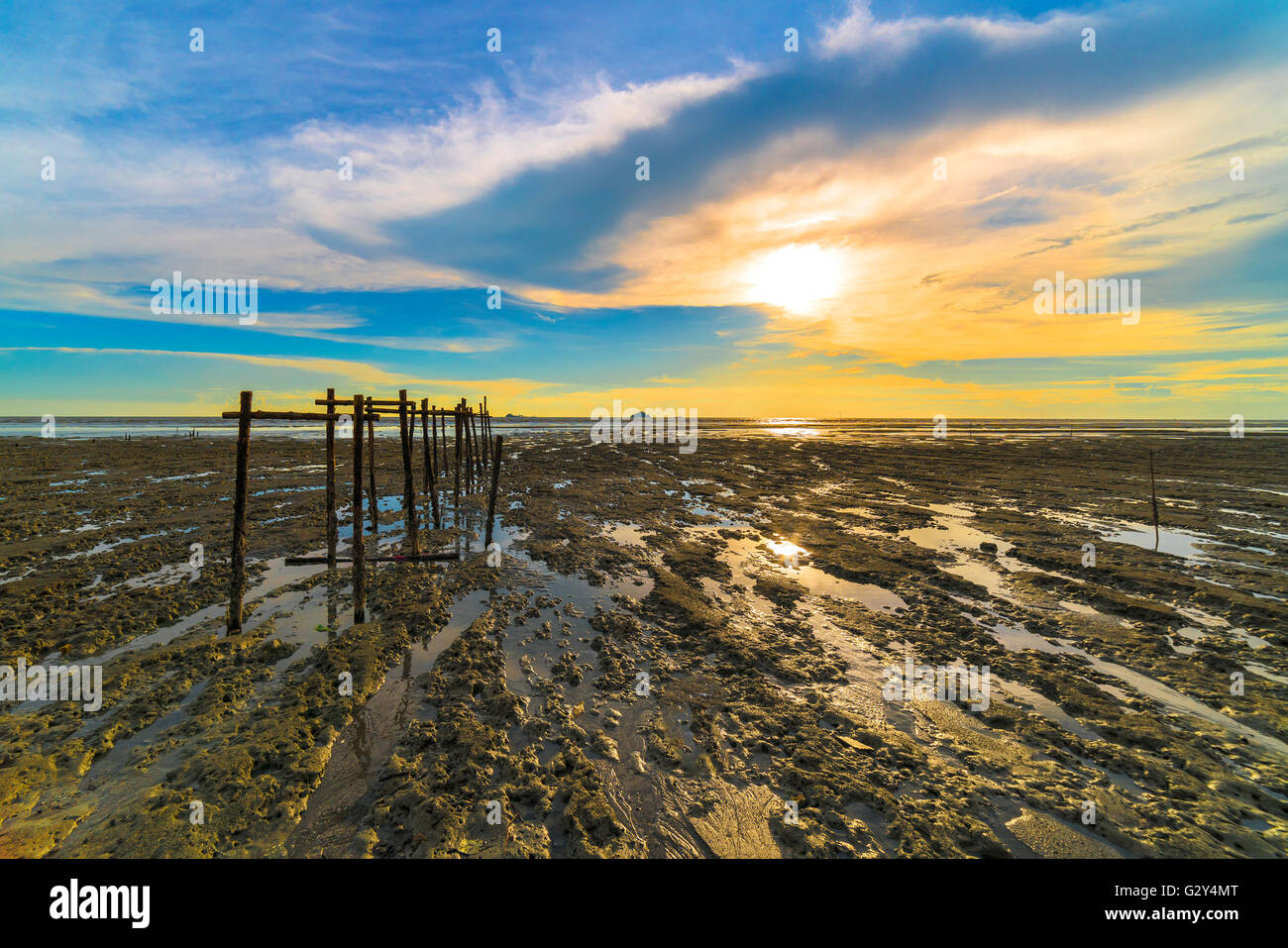 Wooden jetty with sunset background Stock Photo - Alamy