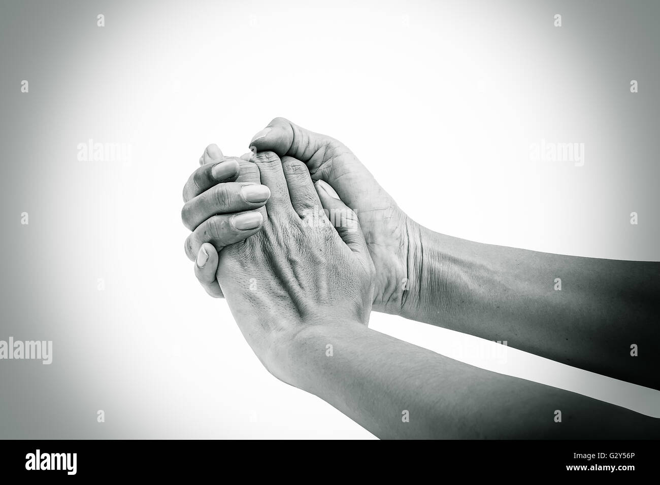 Hands clasped hands with hope isolated on white background Stock Photo ...