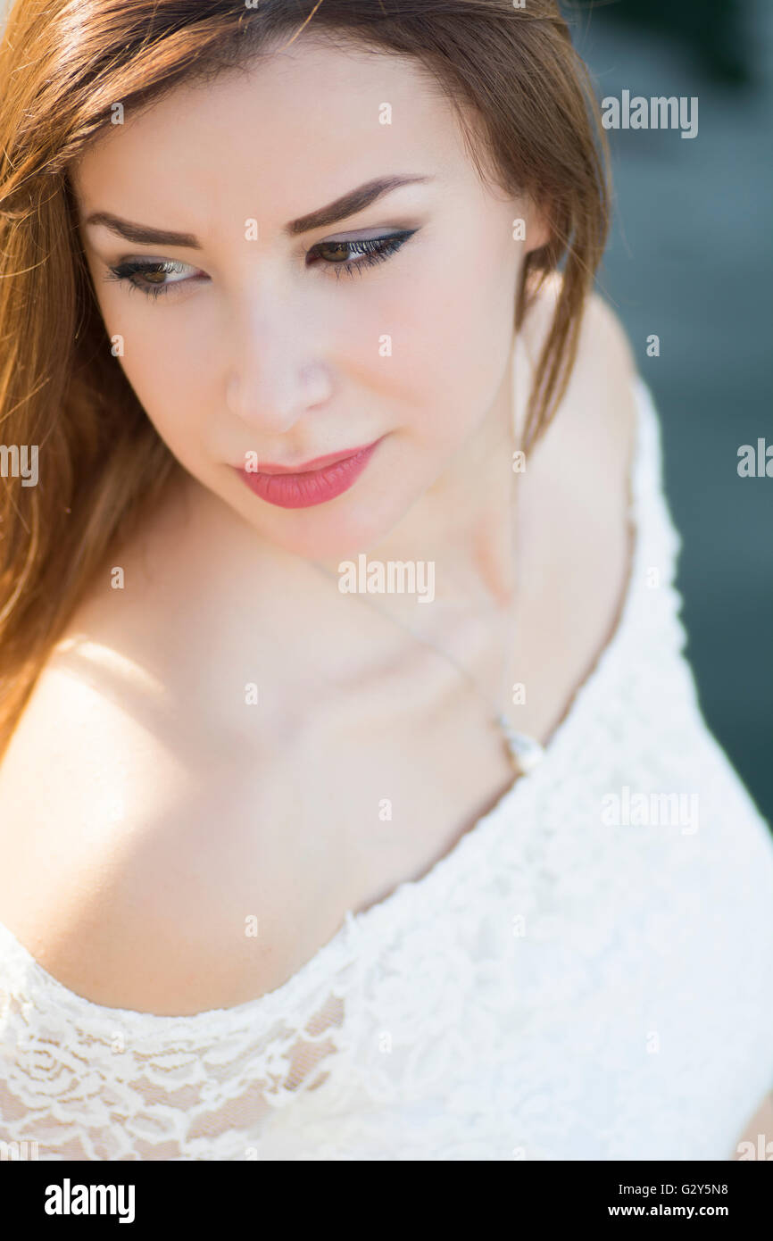Beautiful young woman looking away Stock Photo - Alamy