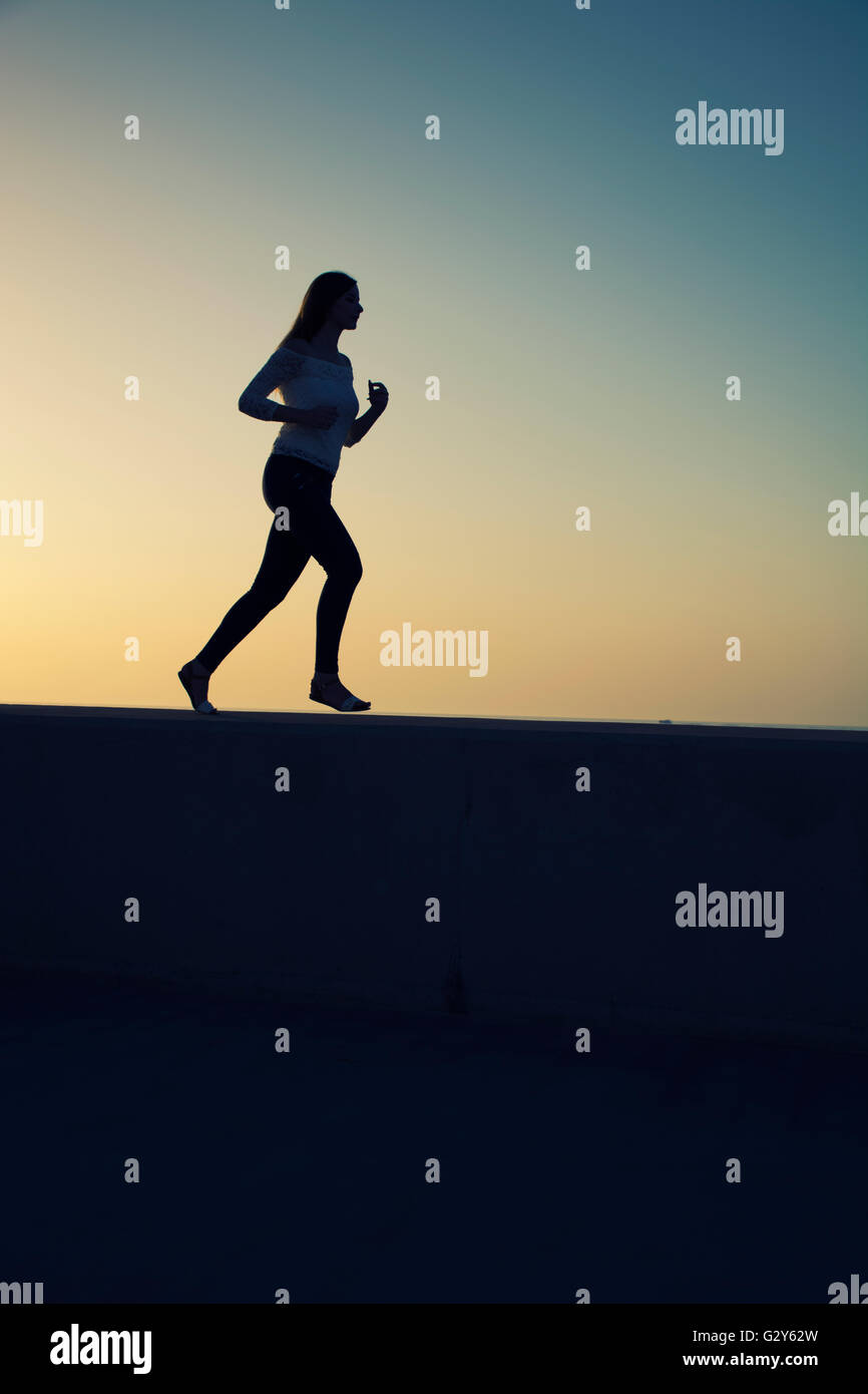 Running woman silhouette hi-res stock photography and images - Alamy