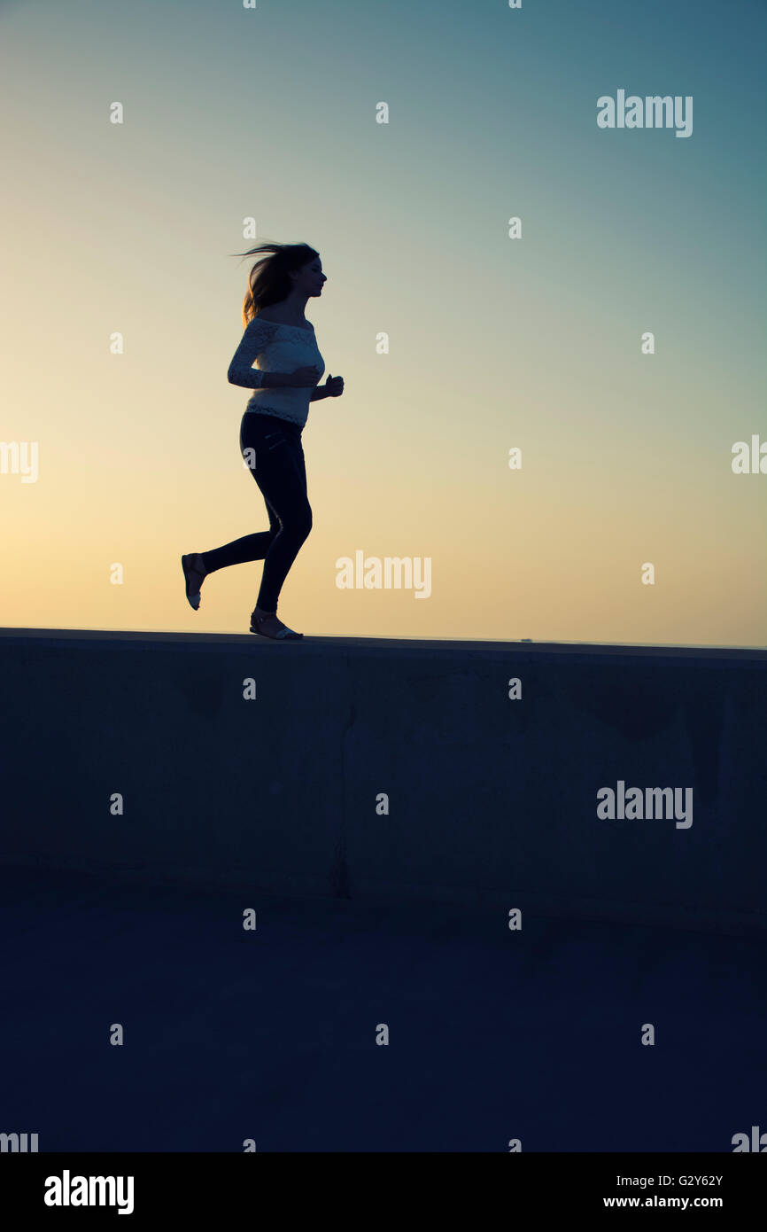 Running woman silhouette hi-res stock photography and images - Alamy