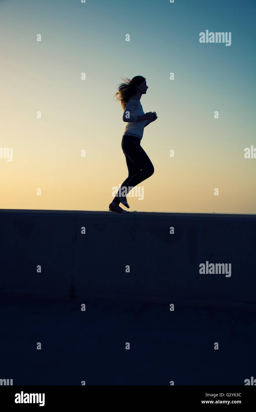 Silhouette of a woman running outdoors Stock Photo - Alamy