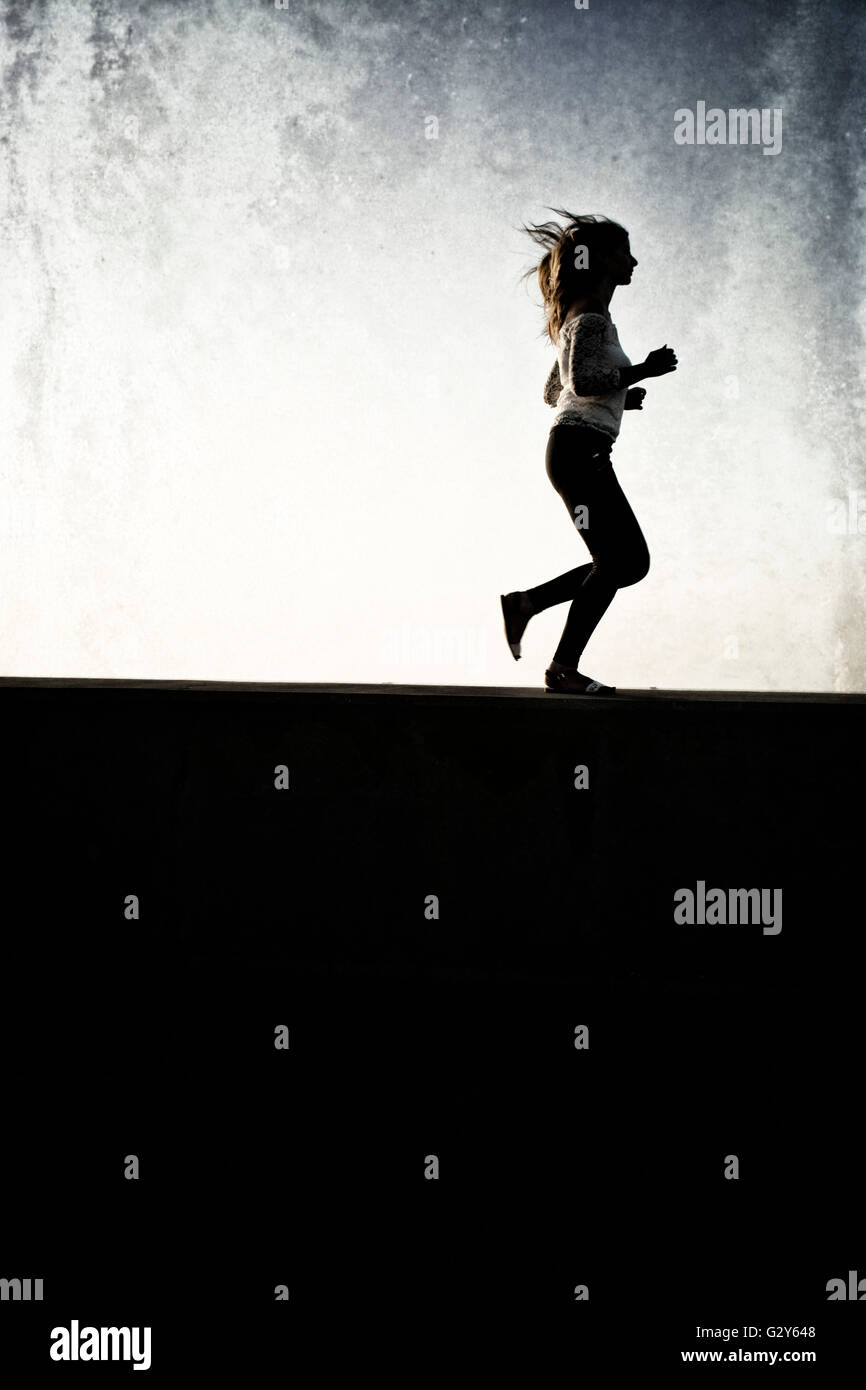 Silhouette of a woman running outdoors Stock Photo - Alamy
