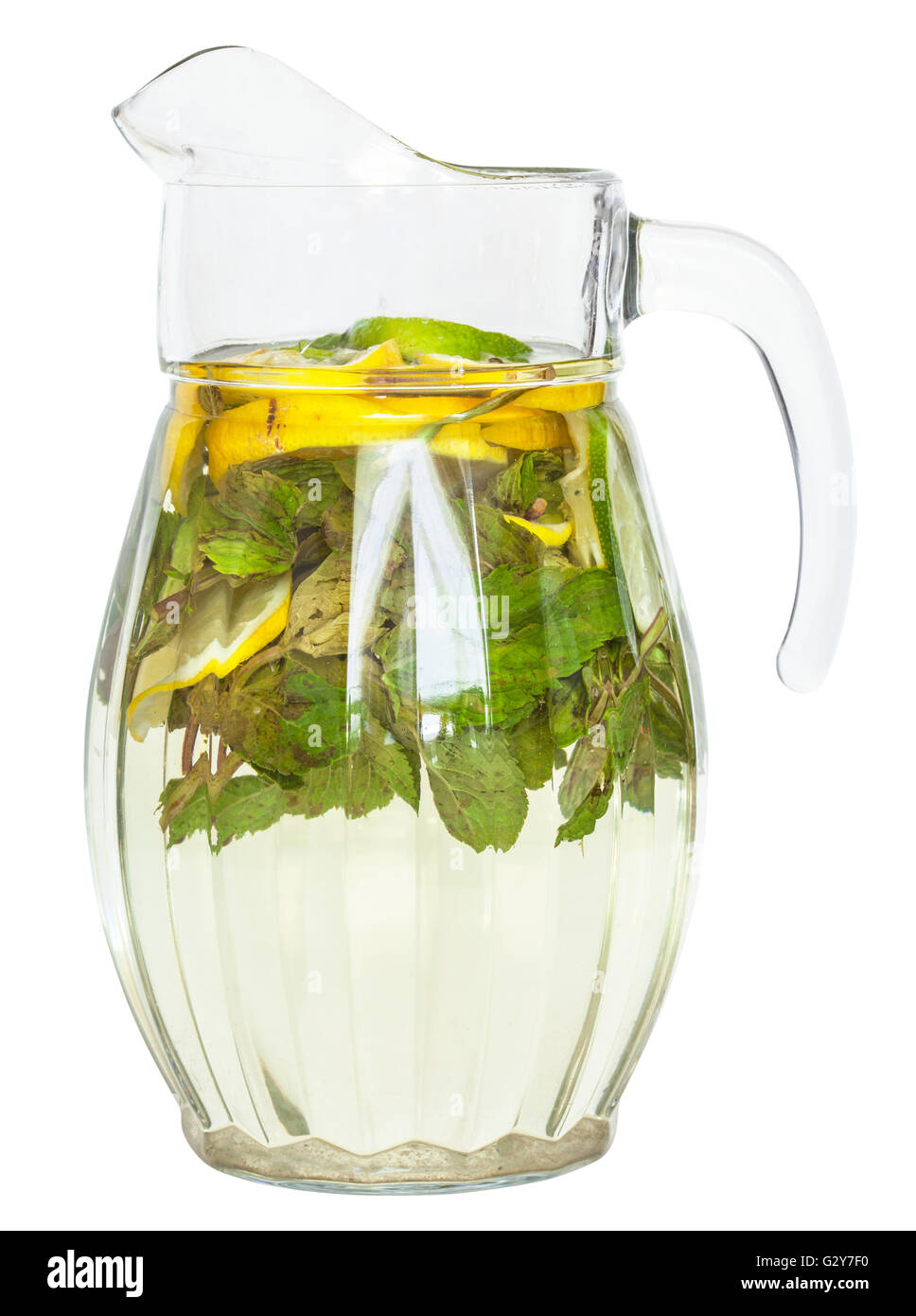 side view of glass pitcher with natural lemonade drink from lemon, lime ...