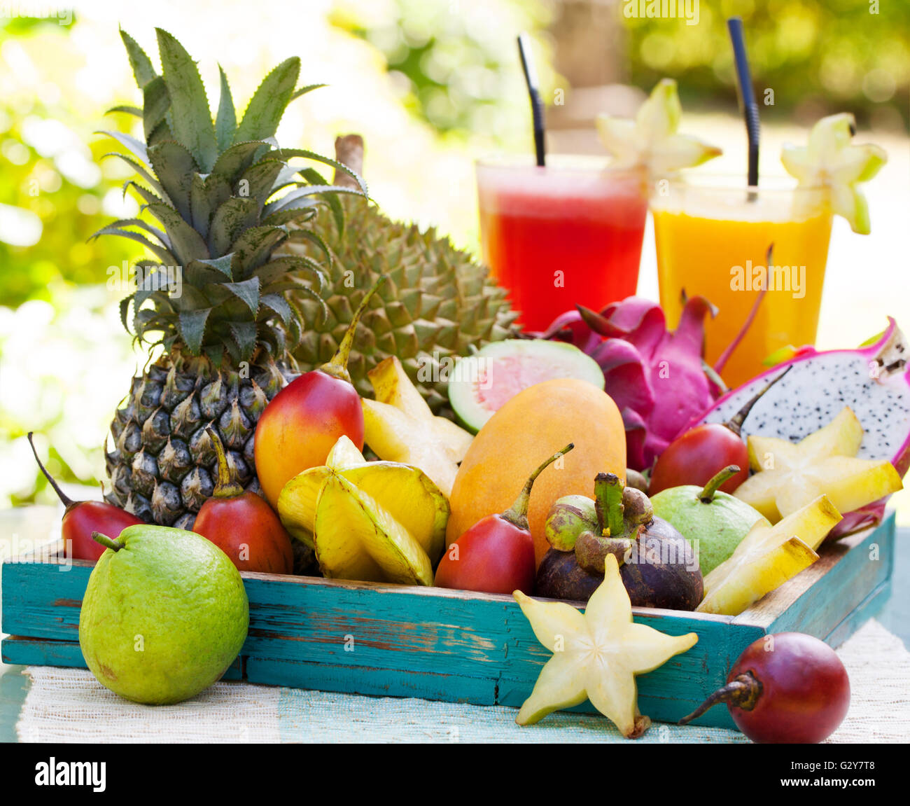 Assortment of tropical fruits, smoothie and juice Stock Photo - Alamy