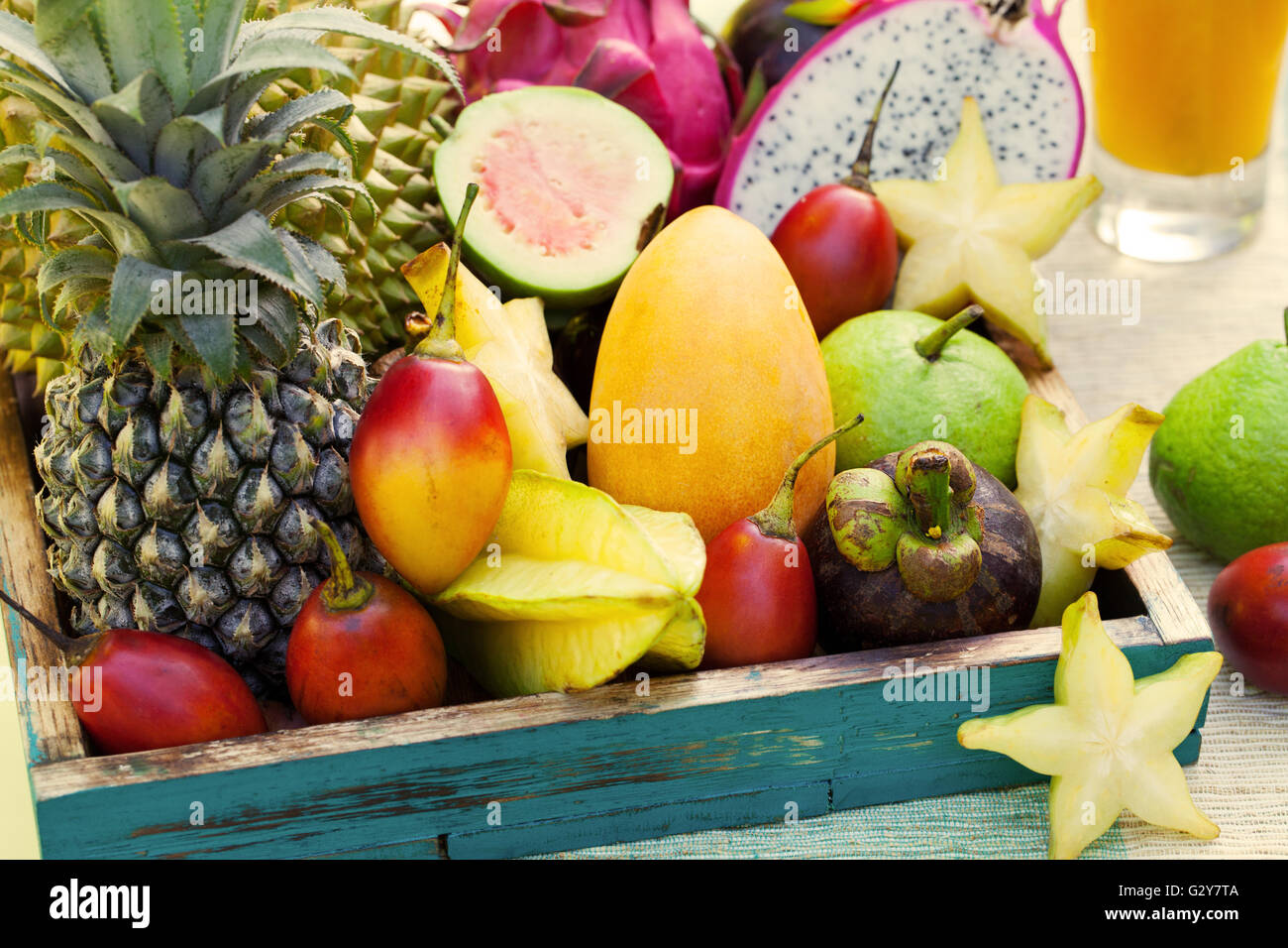 Assortment of tropical fruits, smoothie and juice Stock Photo - Alamy