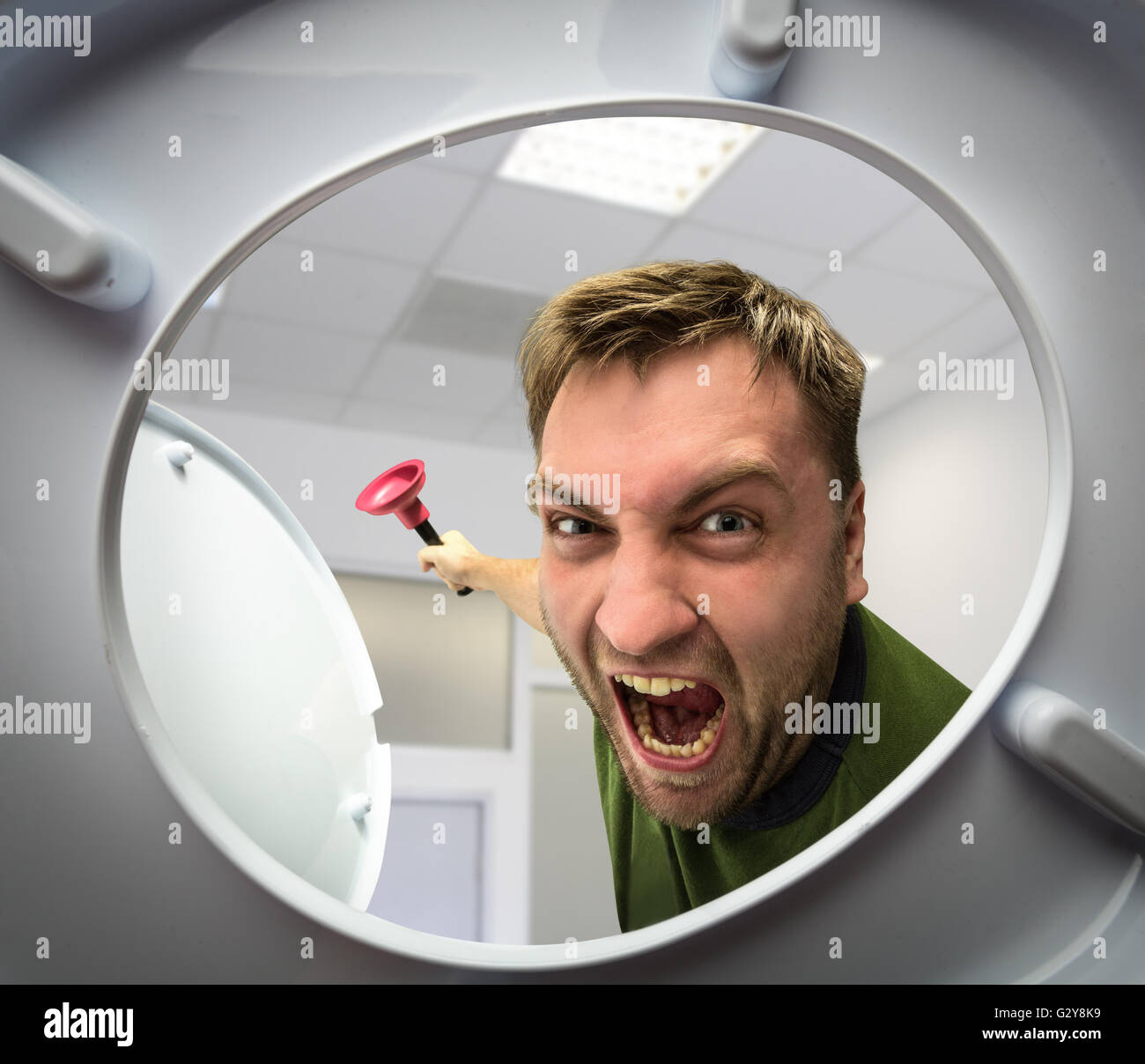 Man with cup plunger Stock Photo - Alamy