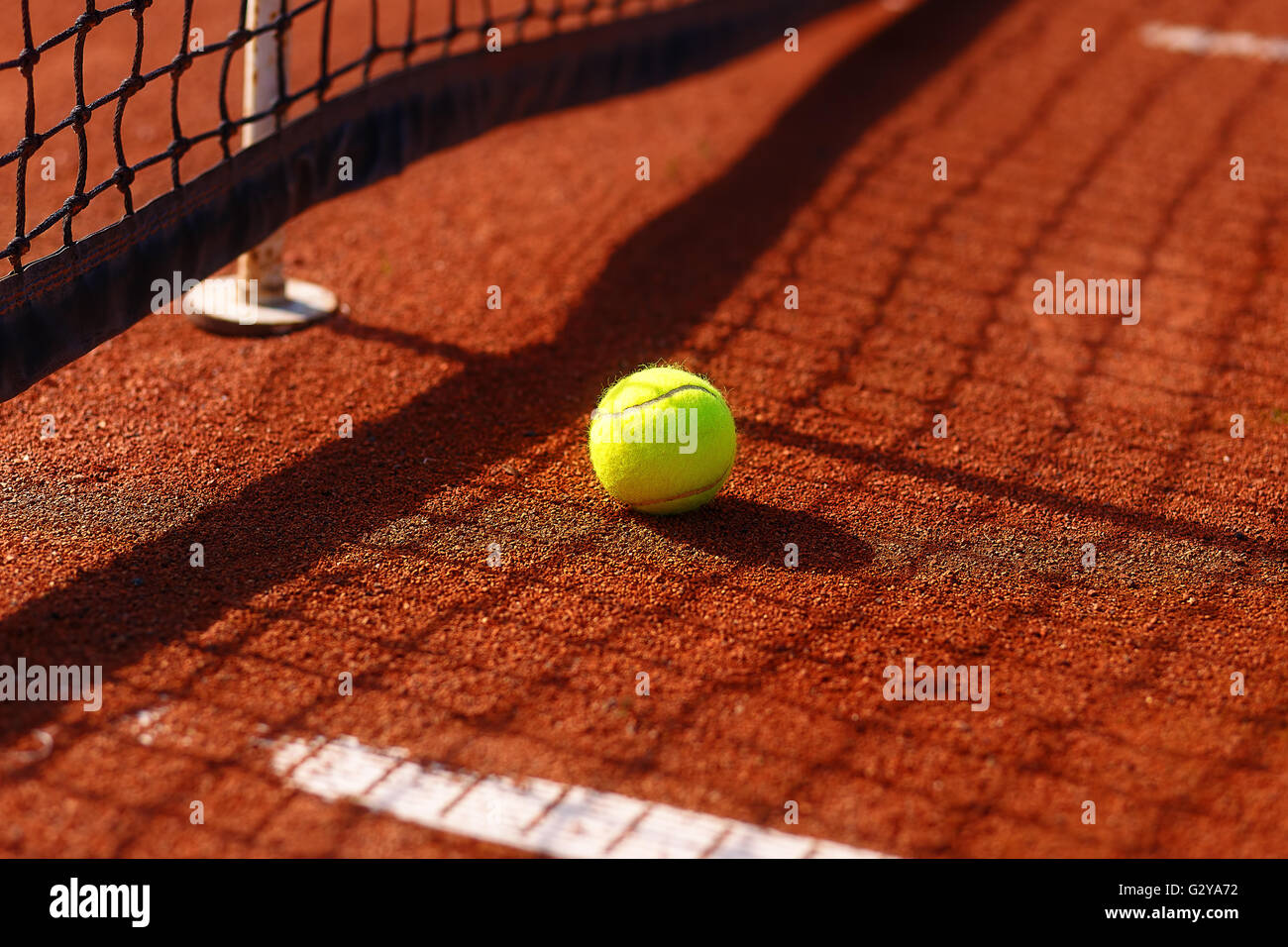 tennis court with tennis ball and antuka background Stock Photo - Alamy