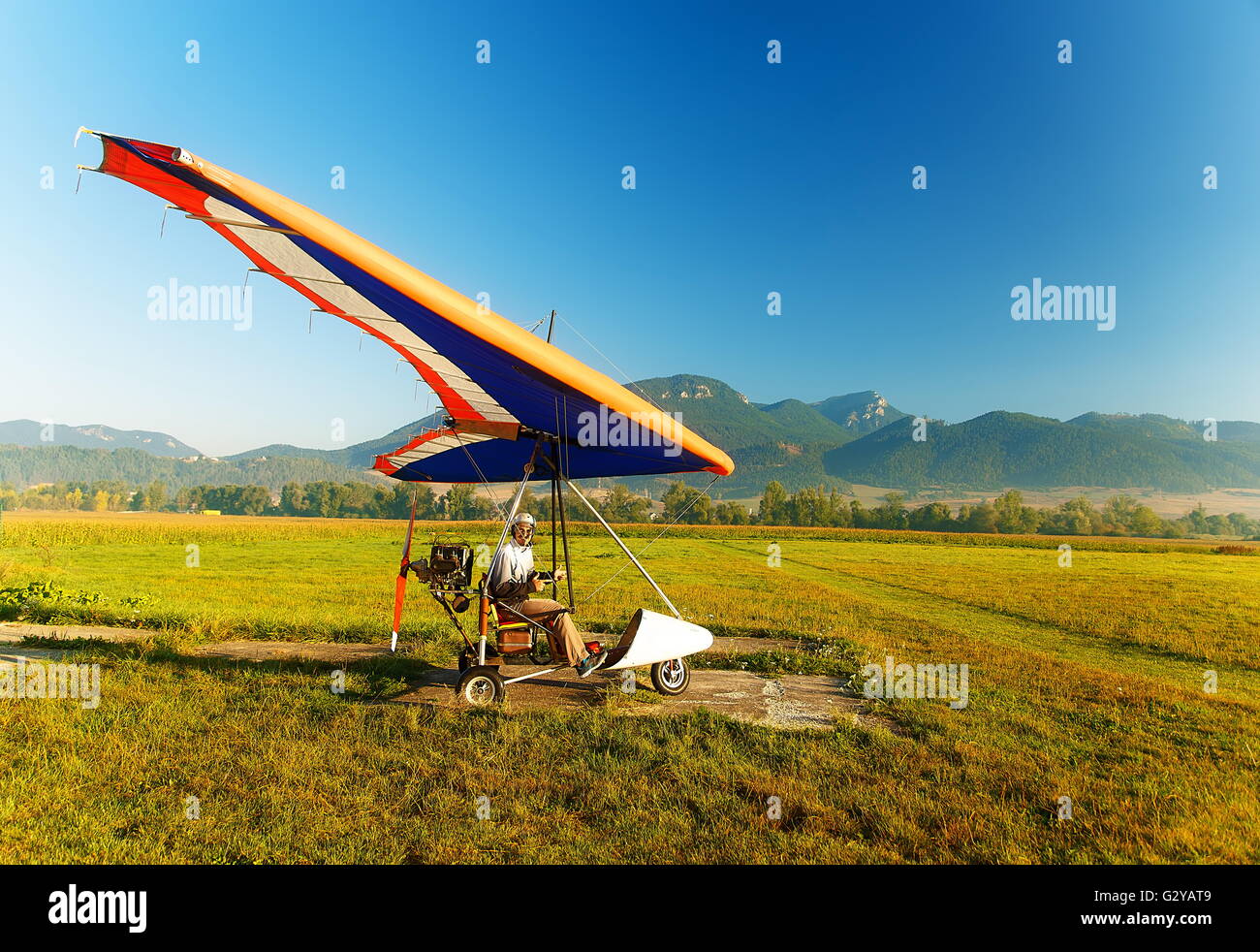 Motor hang glider close up on the ground and man Stock Photo - Alamy