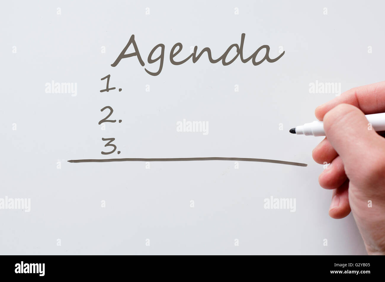 Human hand writing agenda on whiteboard Stock Photo - Alamy