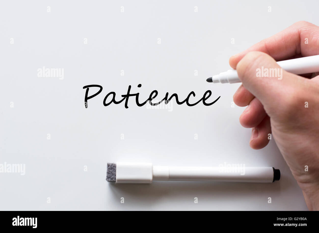 Human hand writing patience on whiteboard Stock Photo - Alamy