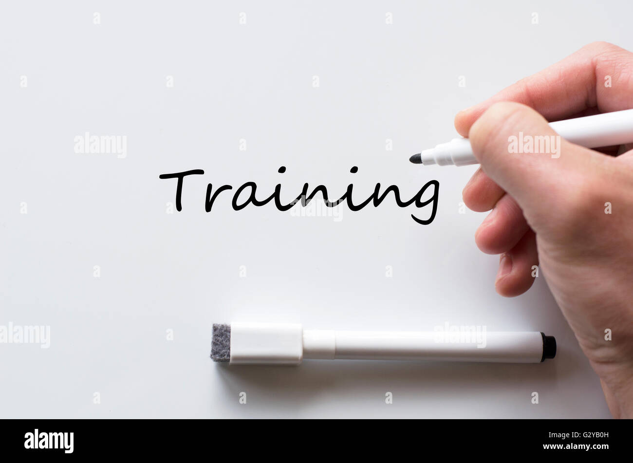 Human hand writing training on whiteboard Stock Photo - Alamy