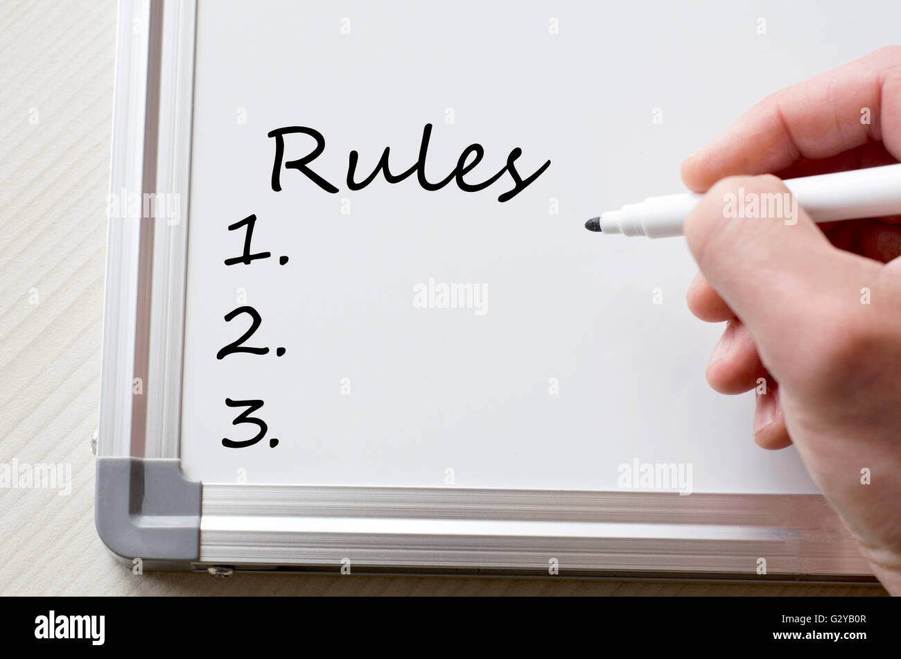 Human hand writing rules on whiteboard Stock Photo - Alamy