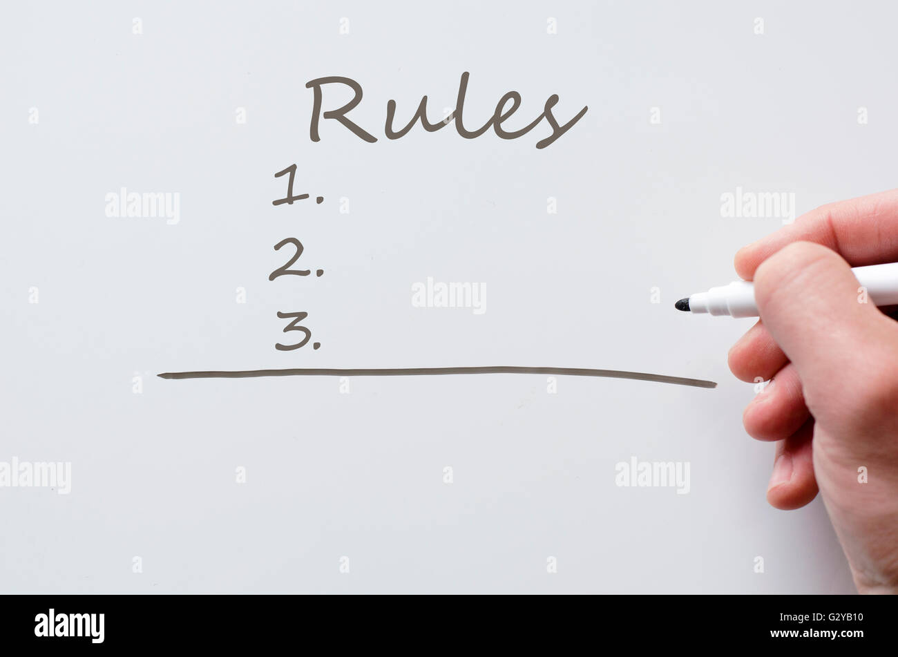 Human hand writing rules on whiteboard Stock Photo - Alamy
