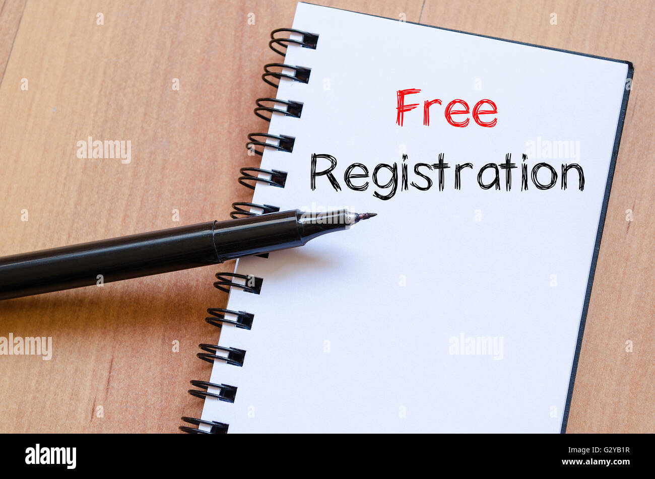 Free registration text concept write on notebook Stock Photo - Alamy