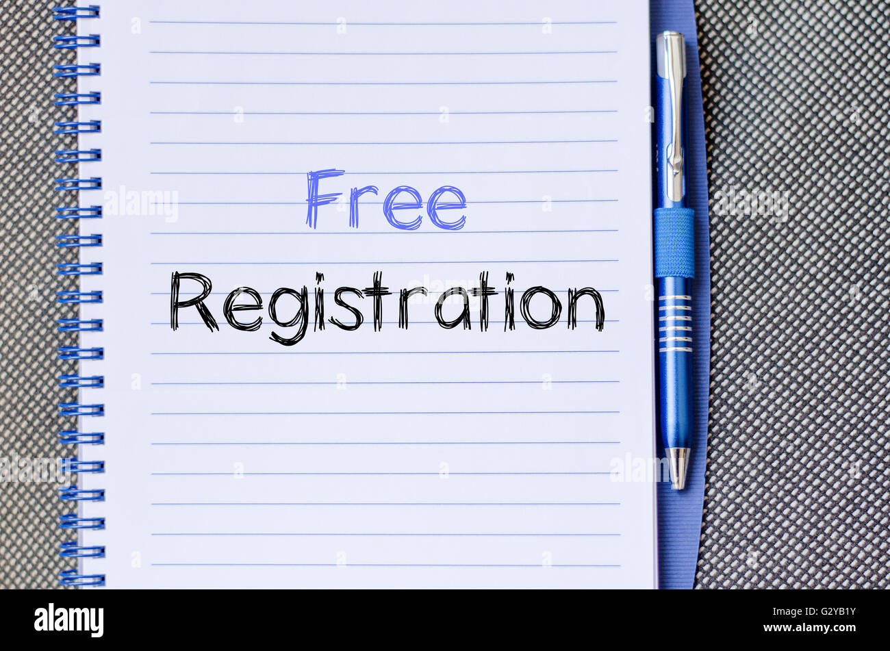 Free registration text concept write on notebook Stock Photo - Alamy