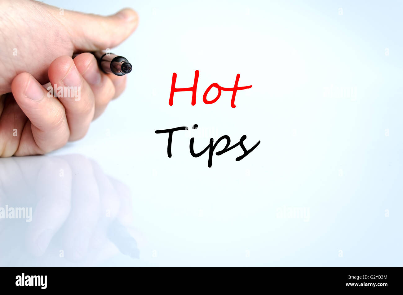 Hot tips text concept isolated over white background Stock Photo - Alamy