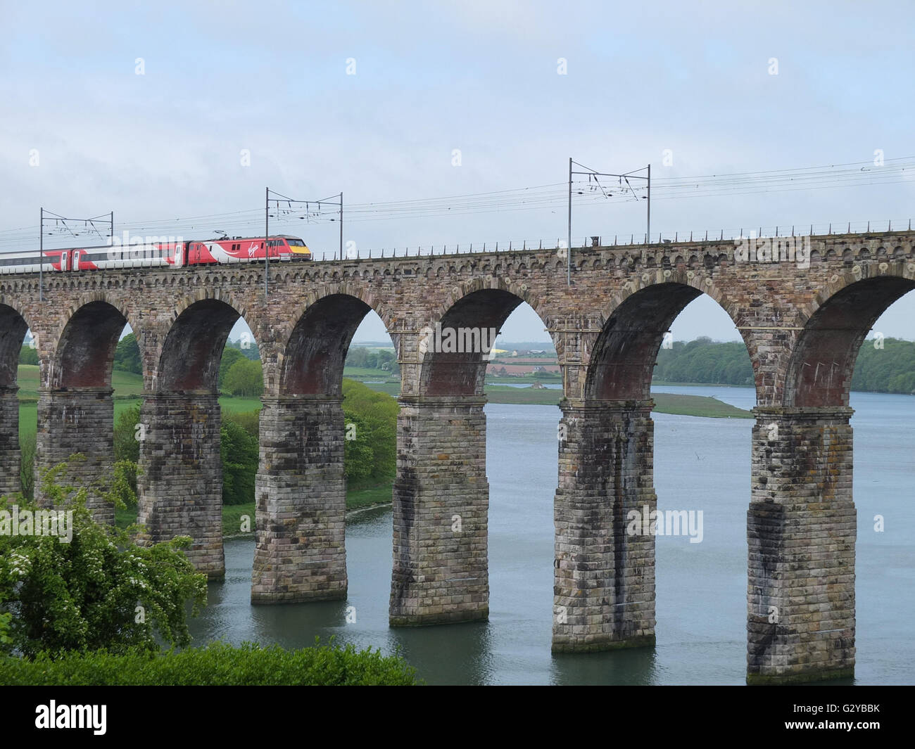 Train on railway crossing border hi-res stock photography and images ...
