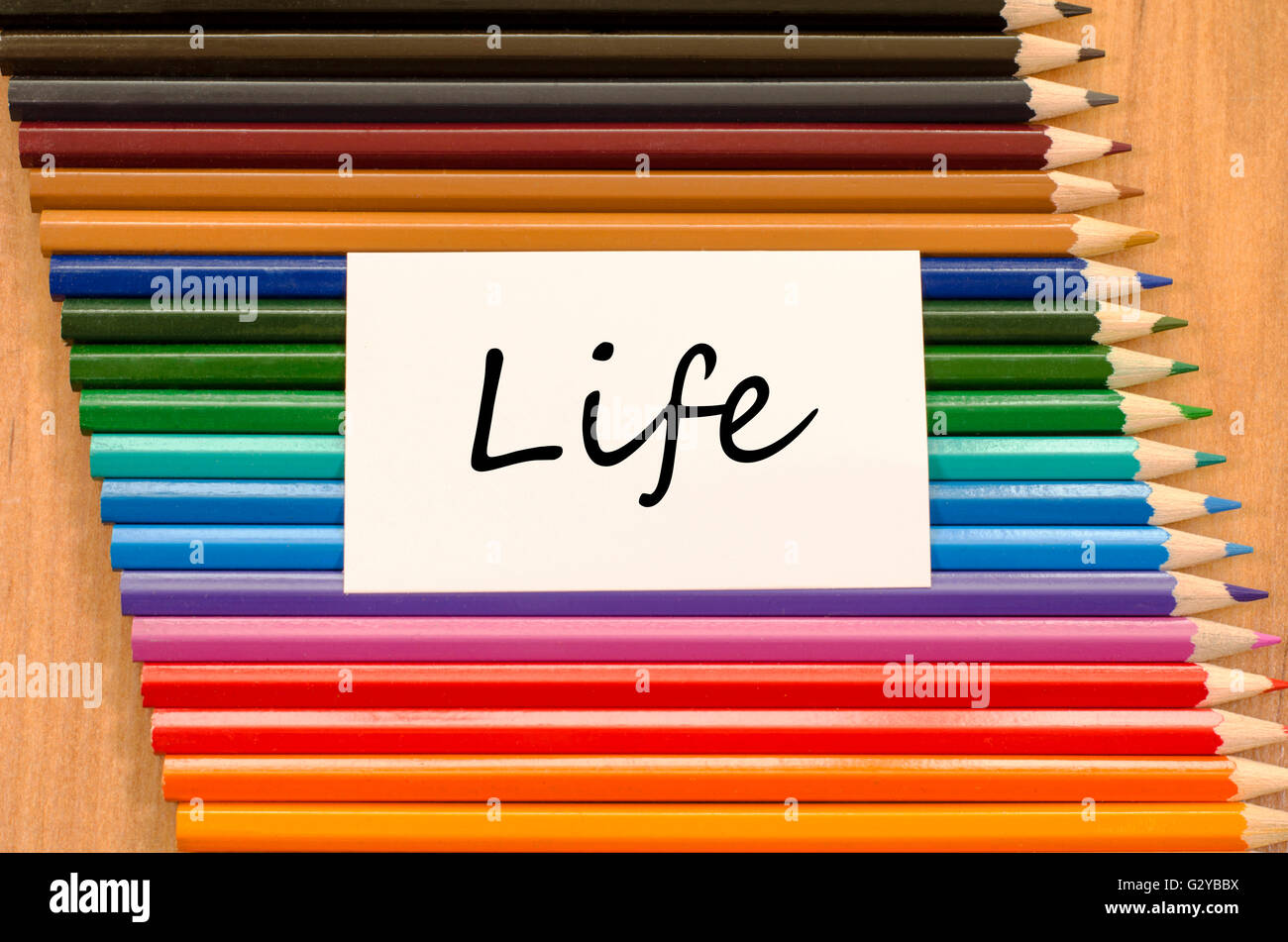 Life text concept and colored pencil on wooden background Stock Photo ...