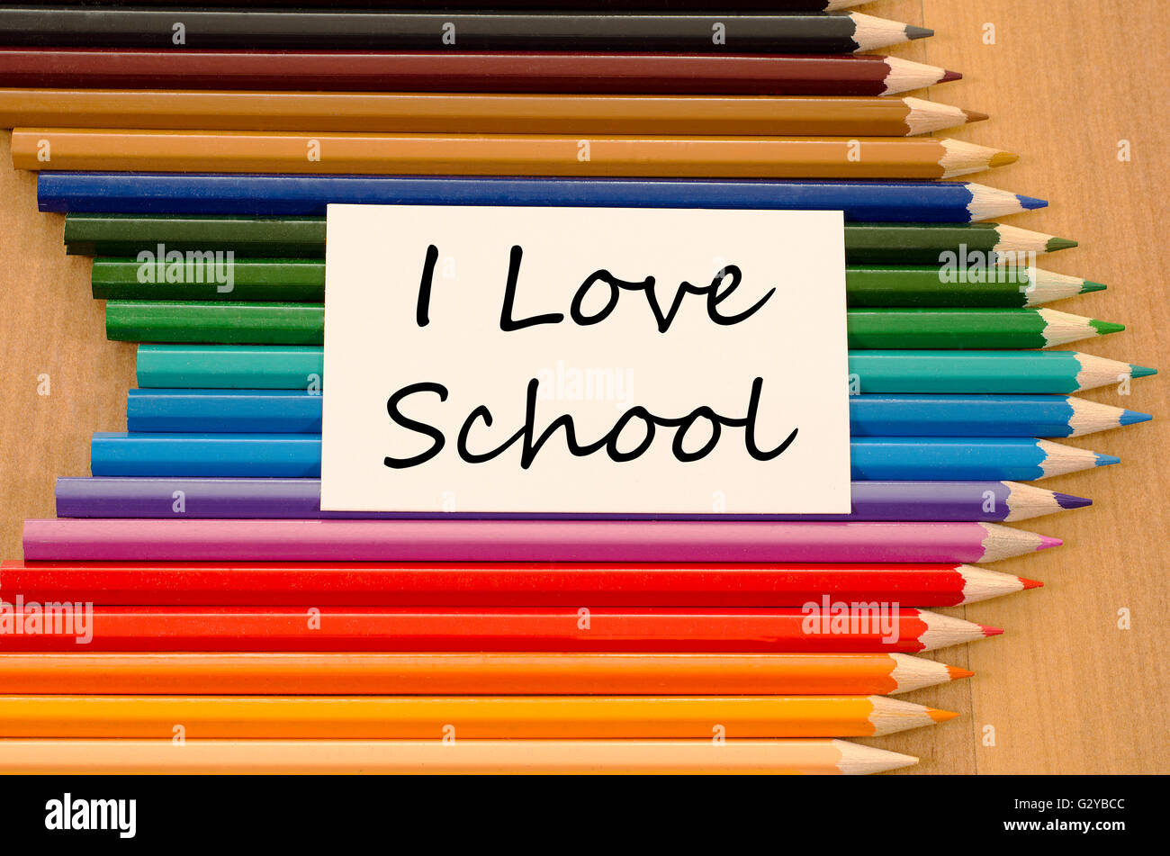 I love school text concept and colored pencil on wooden background ...