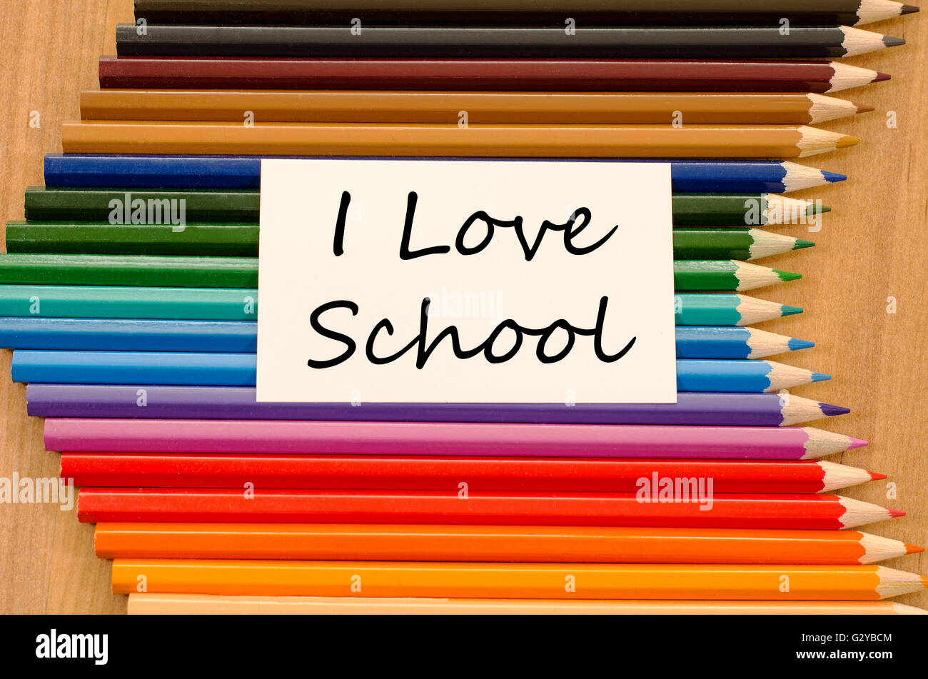 I love school text concept and colored pencil on wooden background ...