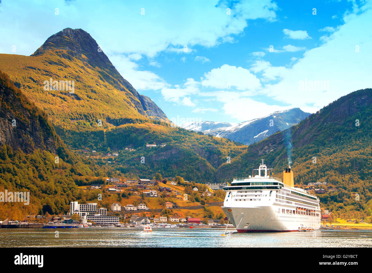 Ferry in Geiranger. bay in the Norwegian mountains. Gold autumn Stock ...