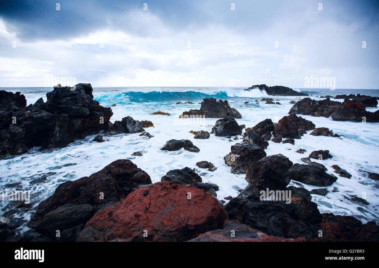 Easter Island rocky coast. The waves of the Pacific Ocean Stock Photo ...