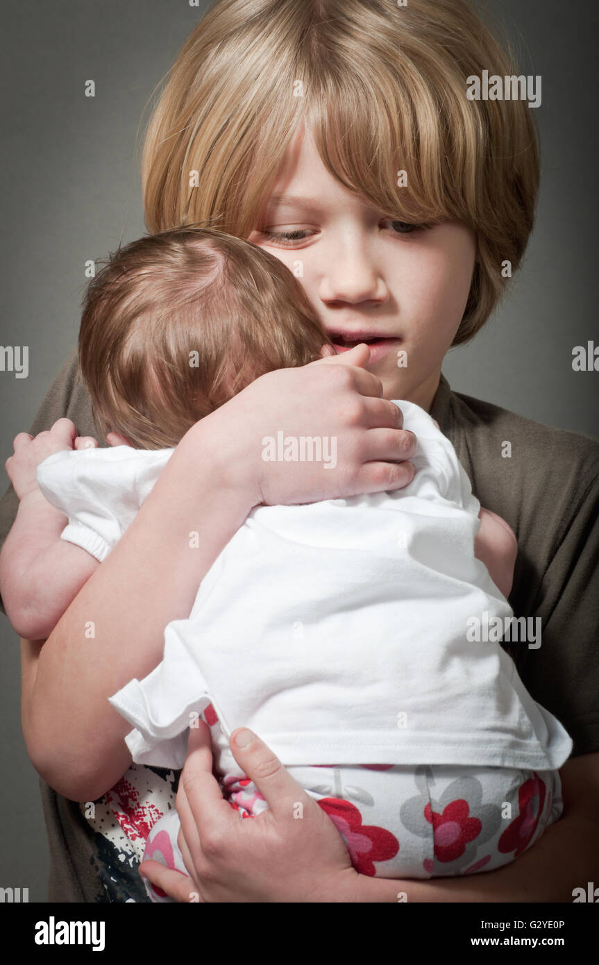 Caring and kind little boy Stock Photo - Alamy