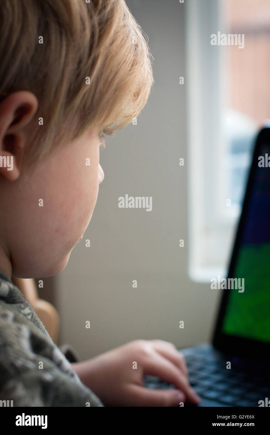 Child looking online Stock Photo - Alamy