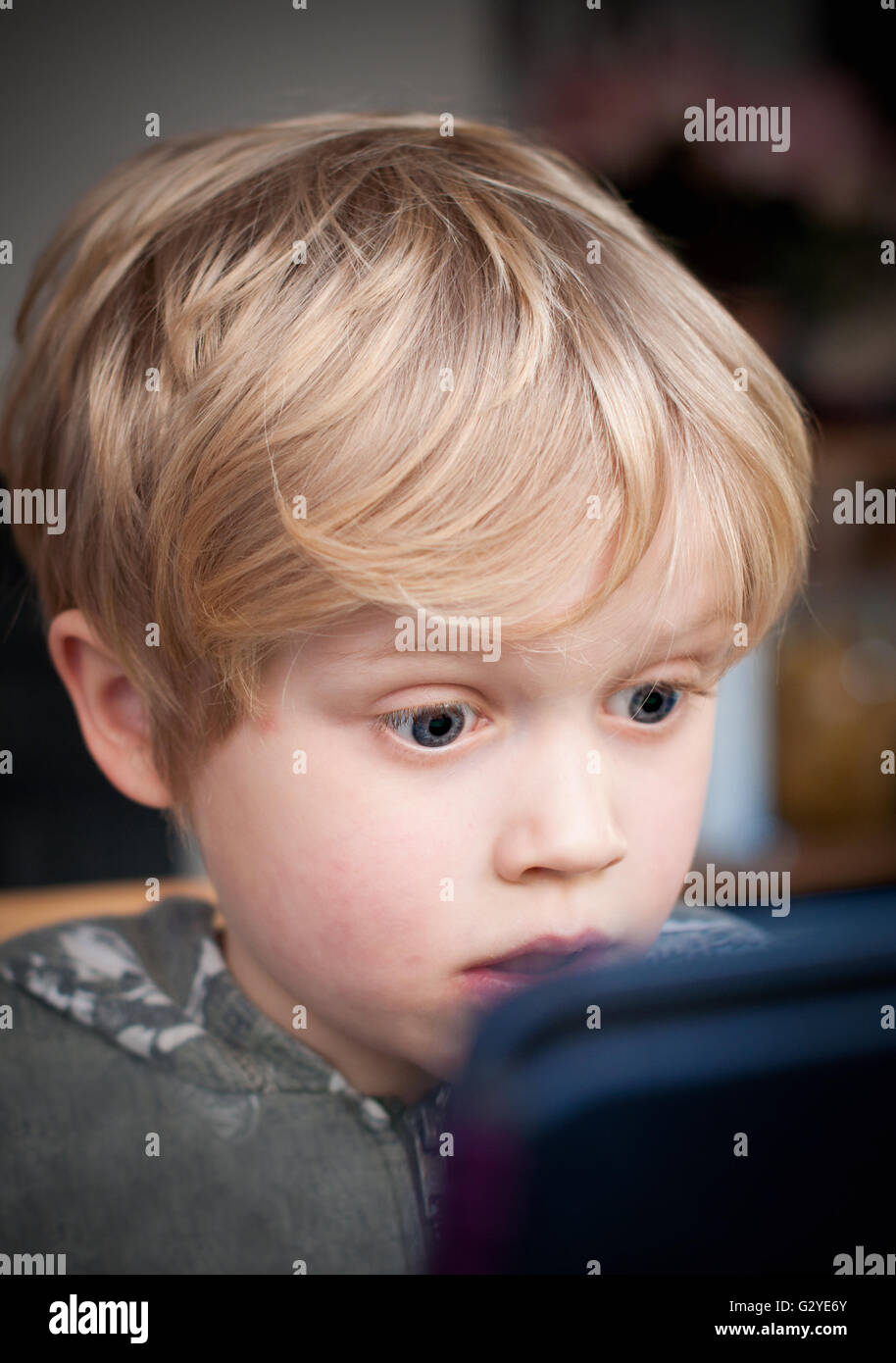 Little boy shocked at web page content Stock Photo - Alamy