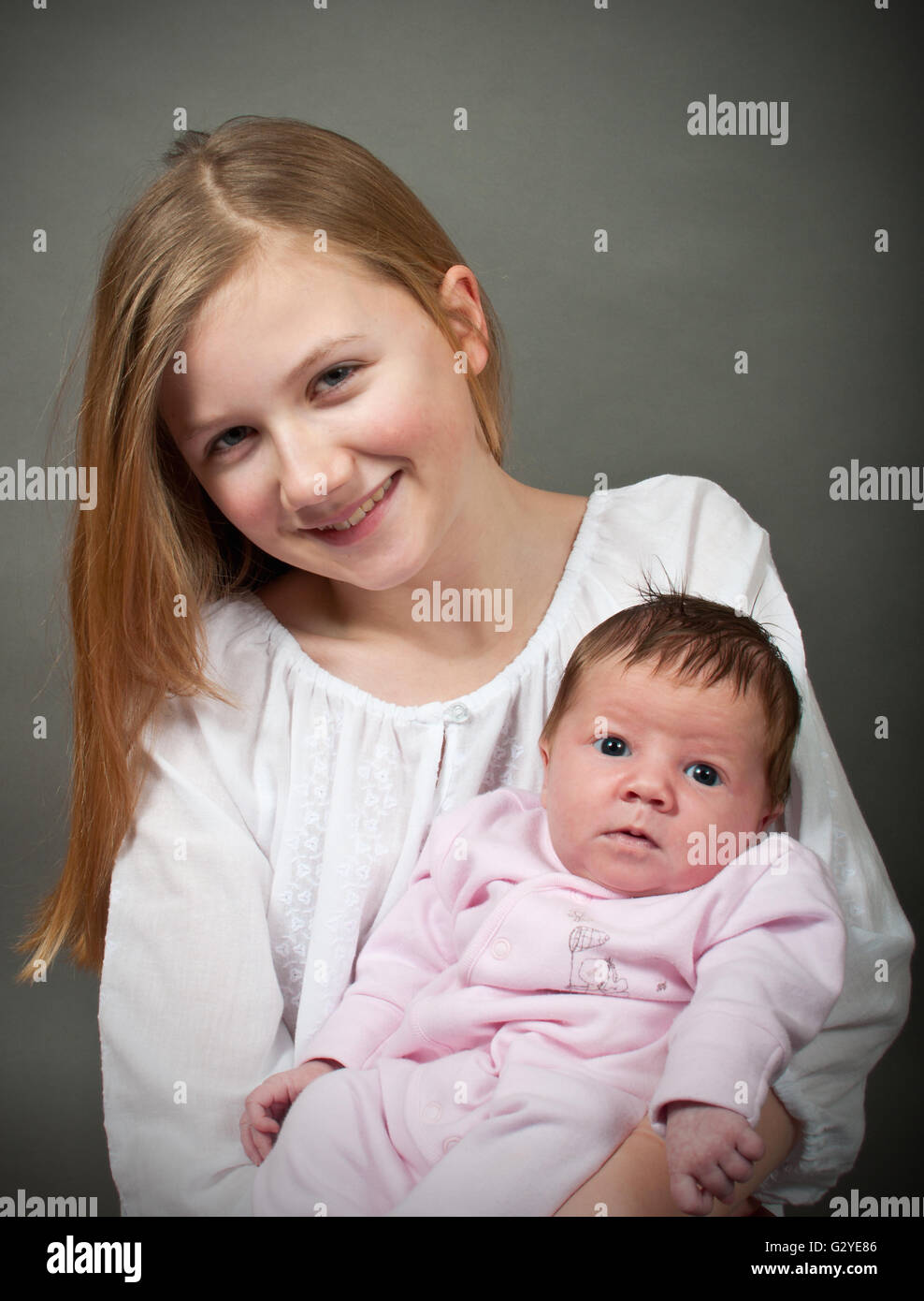 Child caring for siblings hi-res stock photography and images - Alamy