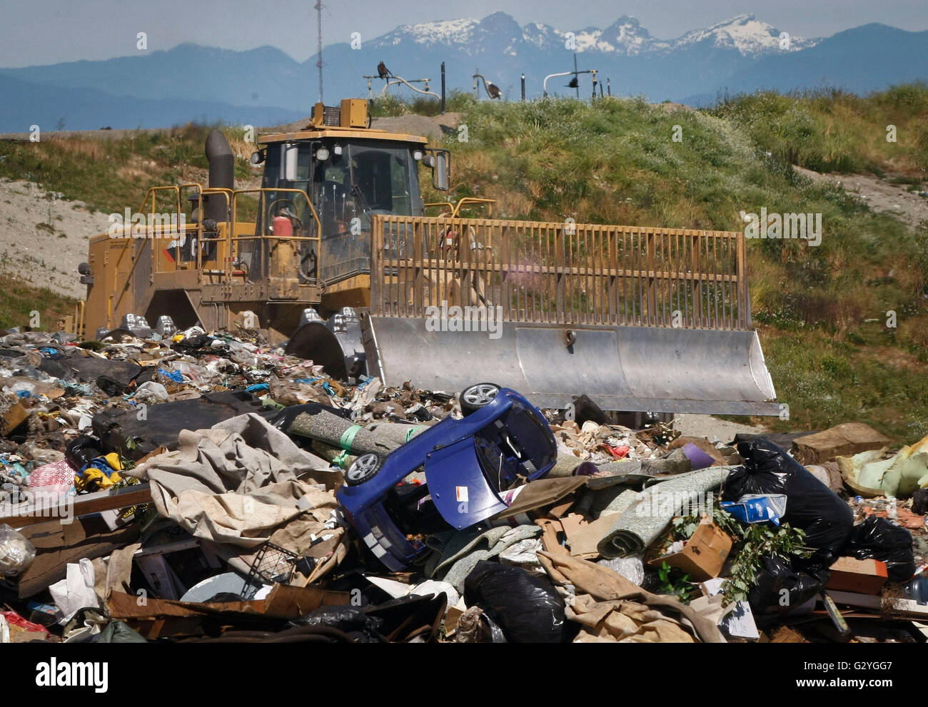 Vancouver, Canada. 4th June, 2016. A compactor works on a landfill site ...