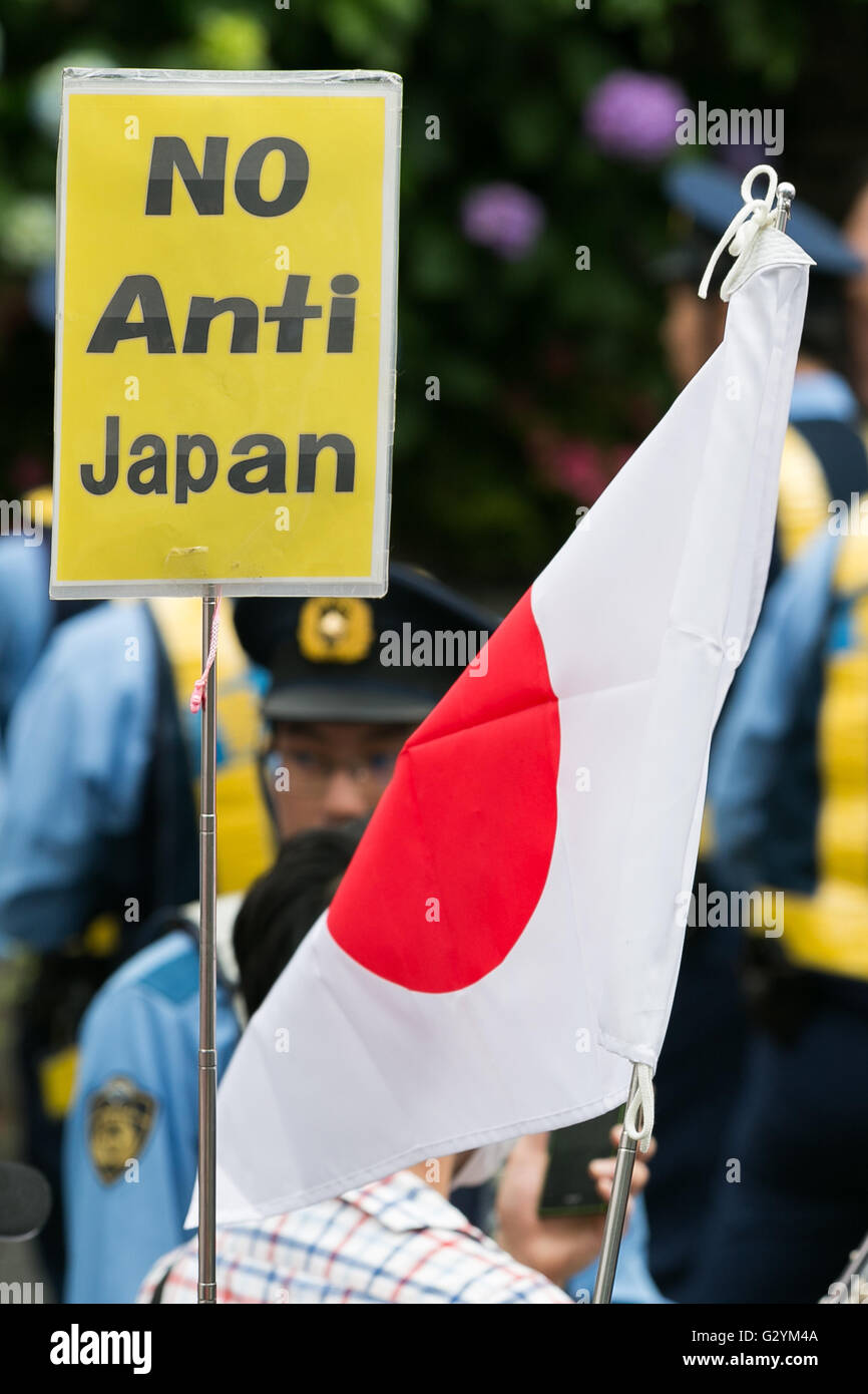 Police guard anti-foreign protesters in Shibuya ward on June 05, 2016 ...