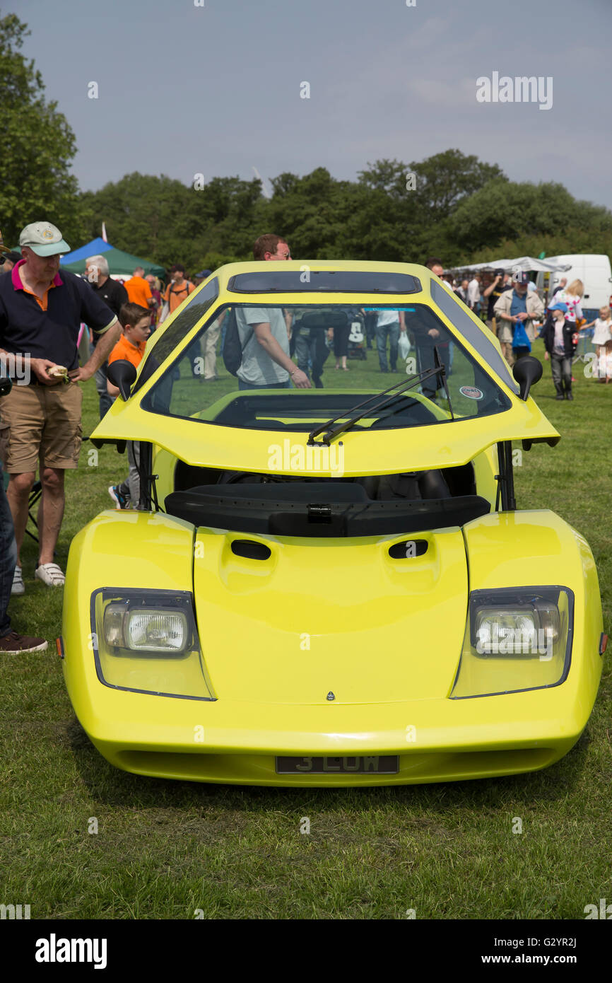 Yellow Kit Car with elevated roof on display at the Classic Car show ...