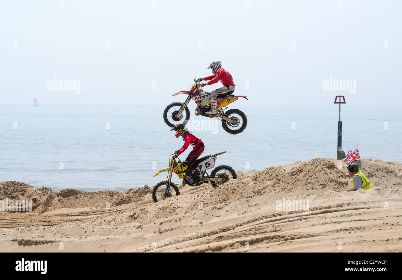 Bournemouth, Dorset, UK. June, 2016. Trail bike riders jumping over a ...