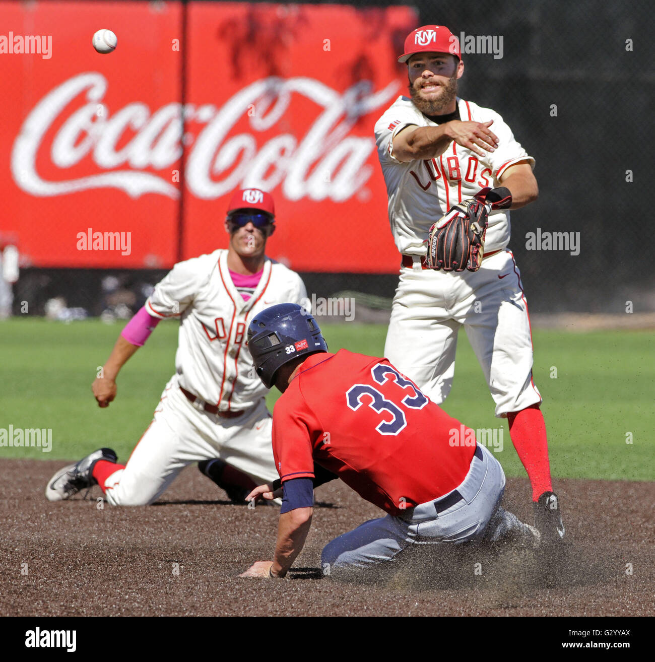 Lubbock, TX, USA. 5th June, 2016. UNM's #23 Jared Holley makes the tag on Dallas Baptist ...