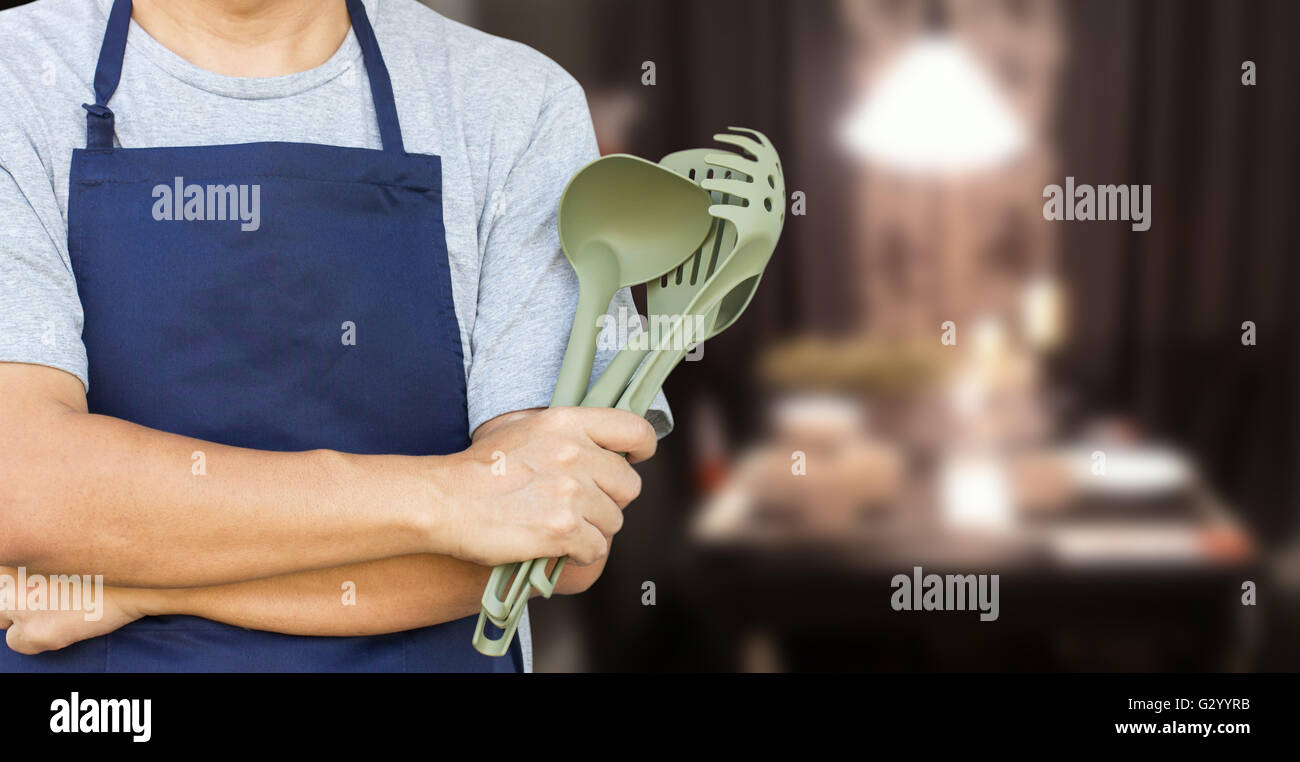 Asian Man Cross Arm With Cooking Tools Stock Photo - Alamy