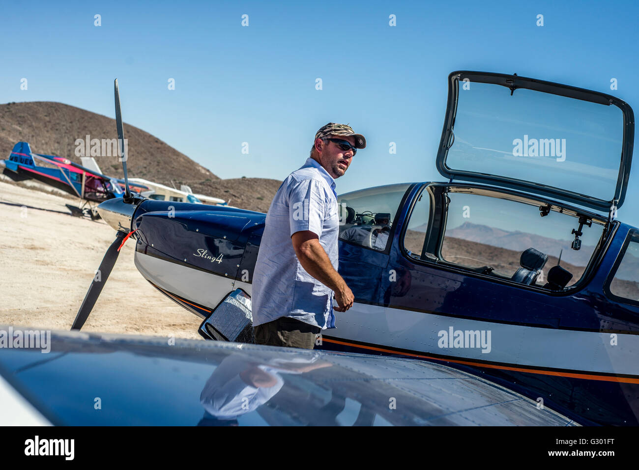 Pilots prepare their plane for flight at Fly-in competitions on ...
