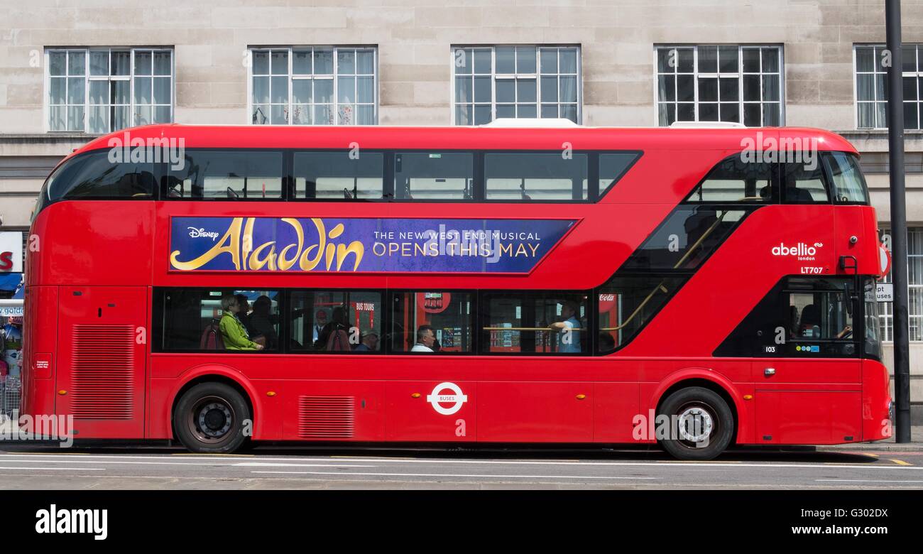 A new route master red london bus displays an advert for Disney's ...
