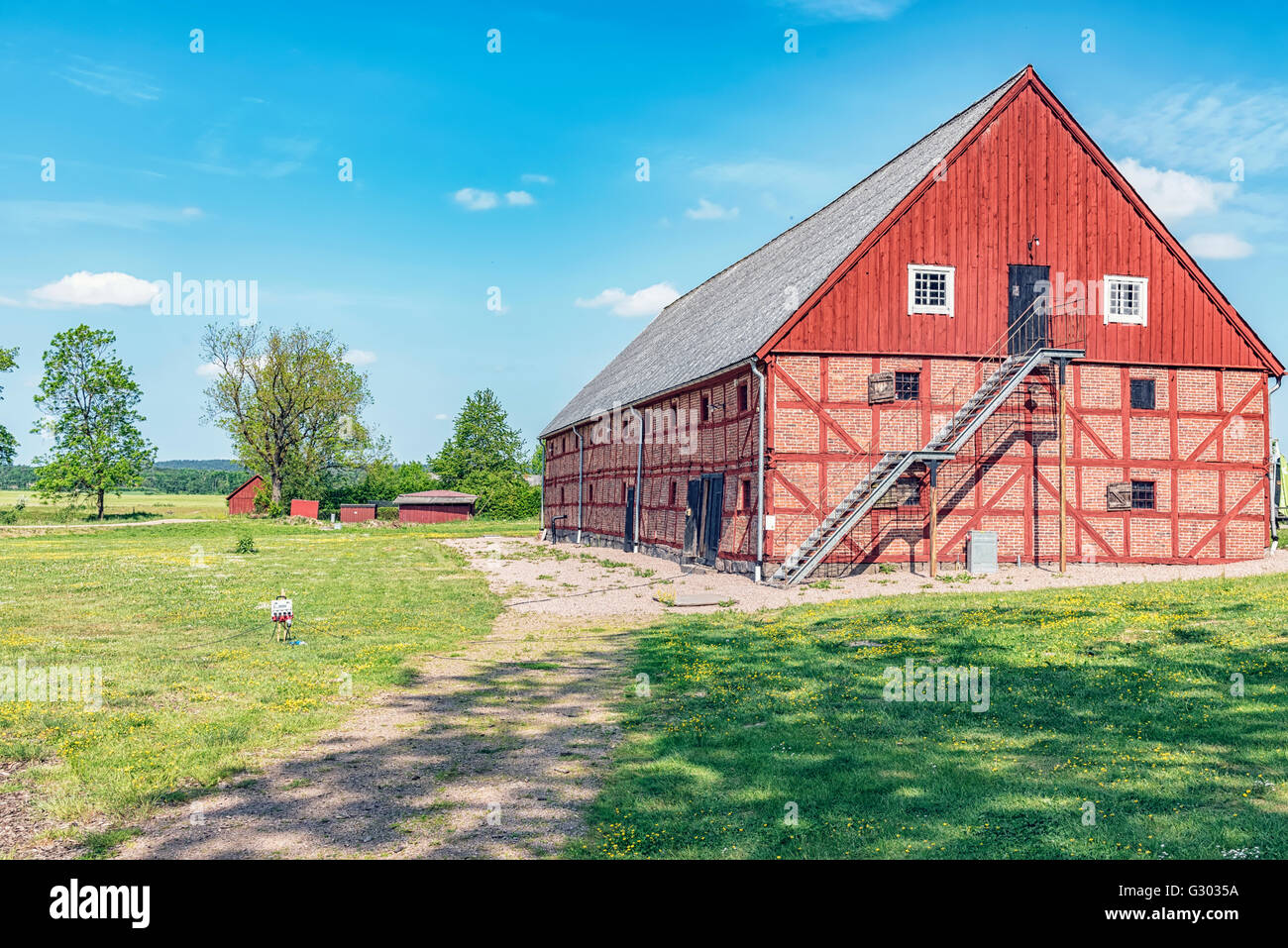 An old red brick barn set in the rural countryside of Swedens Halland ...