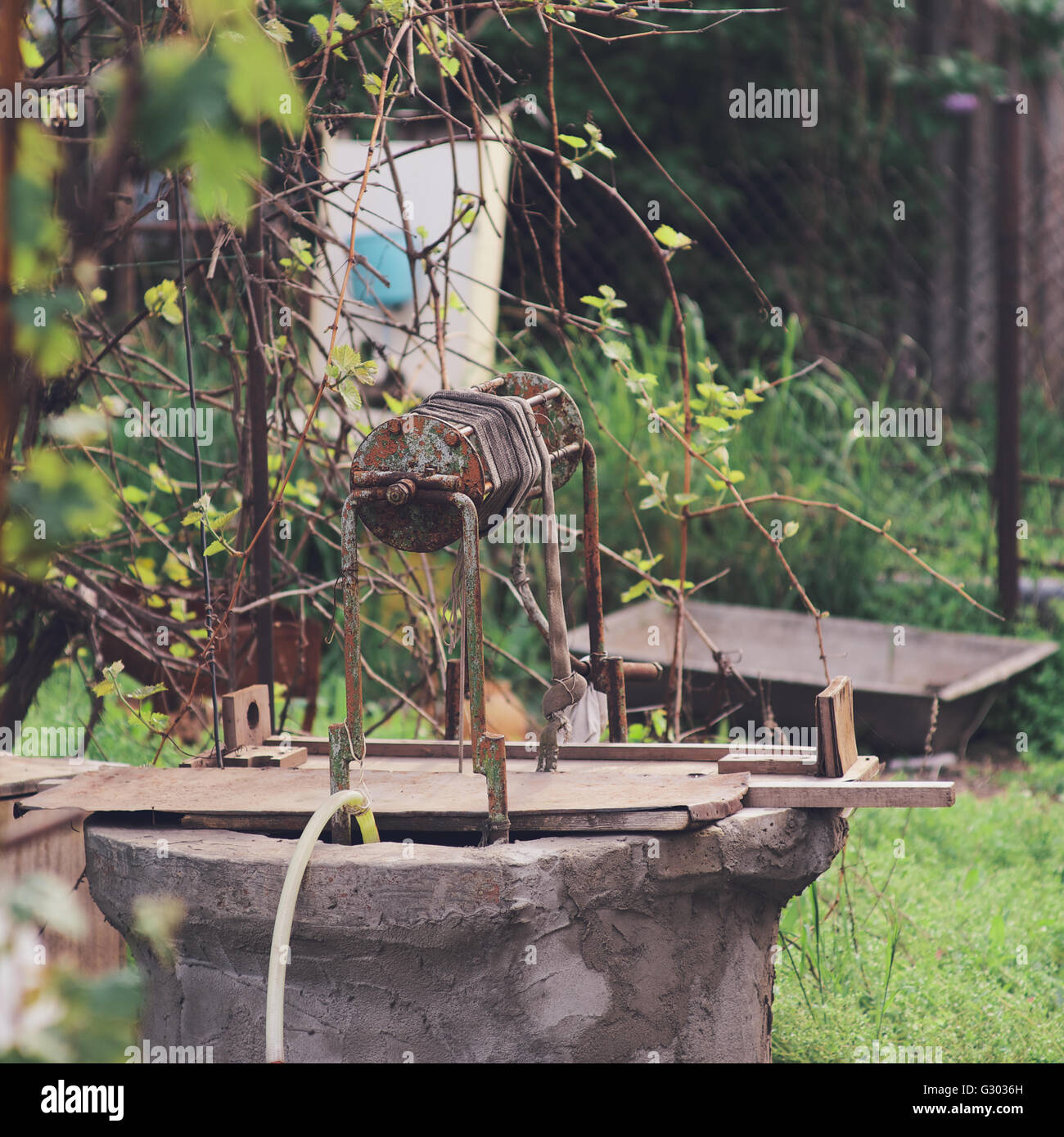 Old stone well with bucket hi-res stock photography and images - Alamy
