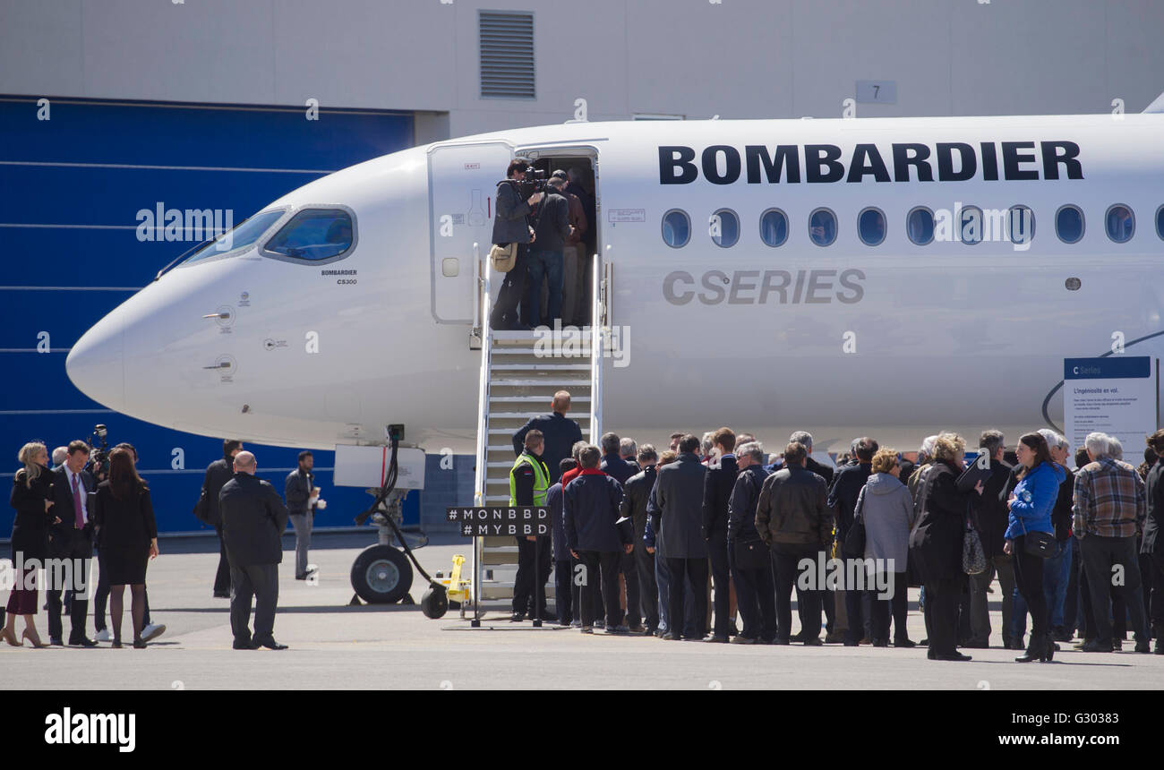 Bombardier shareholders wait in line to take a tour of a Bombardier C ...