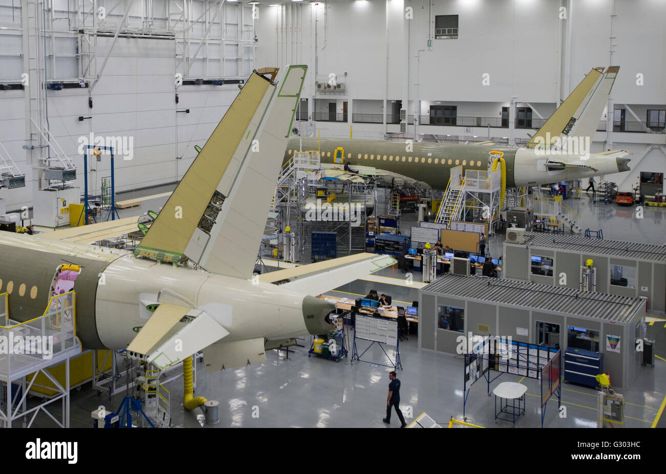 Bombardier C Series jets are shown on the assembly line at a Bombardier ...