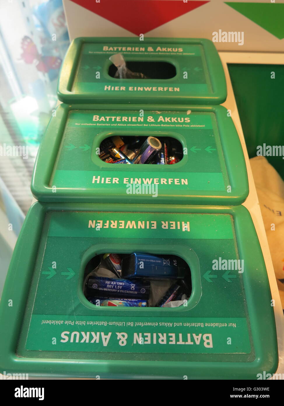 Scrap battery collection station in a department store Stock Photo - Alamy