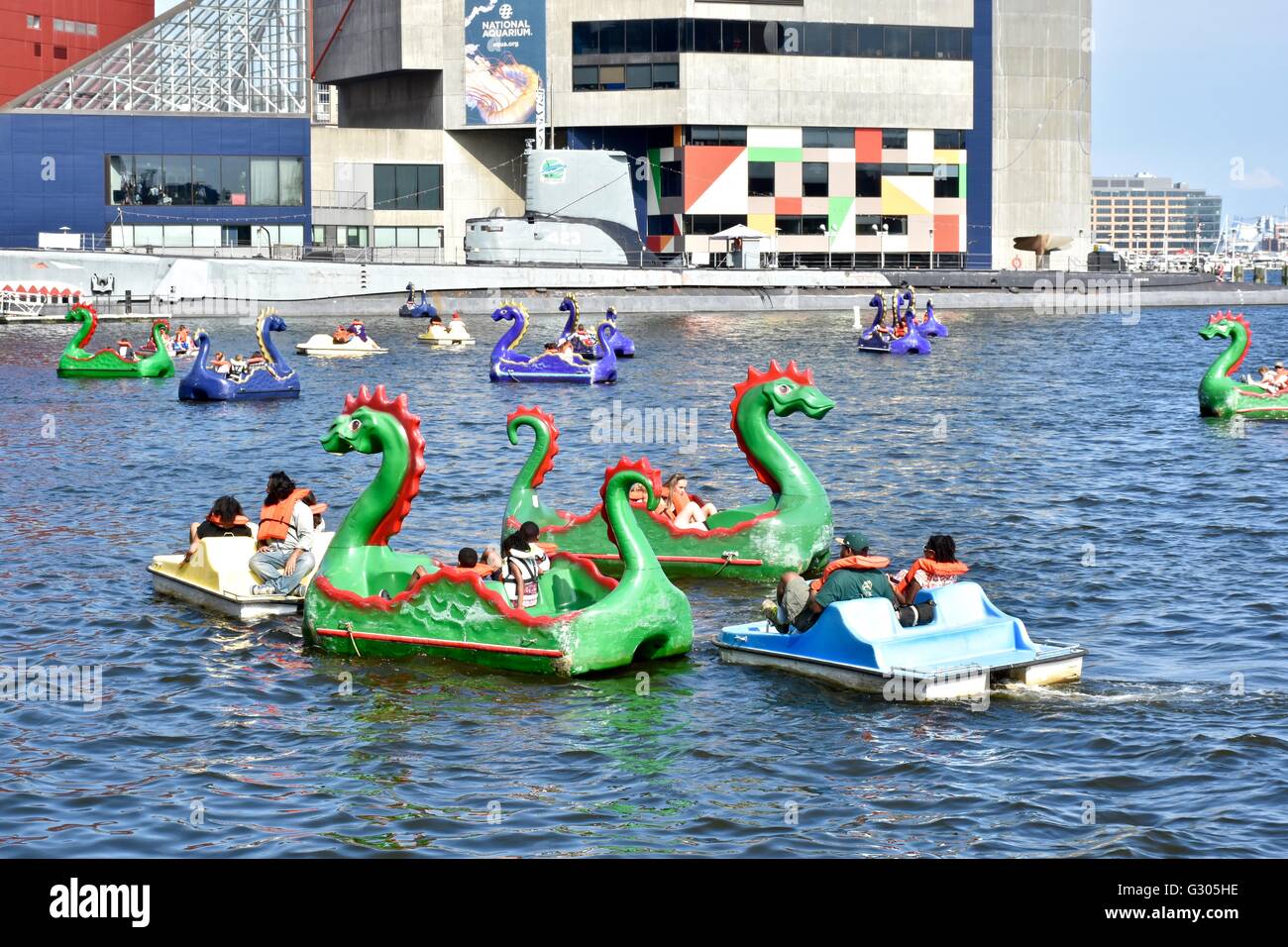 Tourists enjoying a day at the Baltimore inner harbor while taking the ...