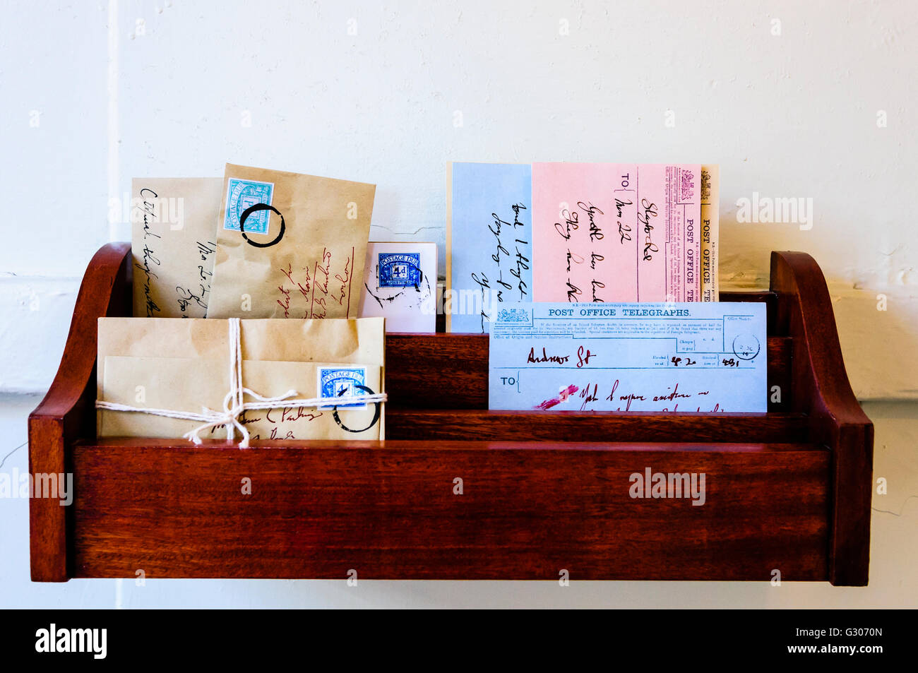 Letter rack from the early 1900s with a selection of letters and ...